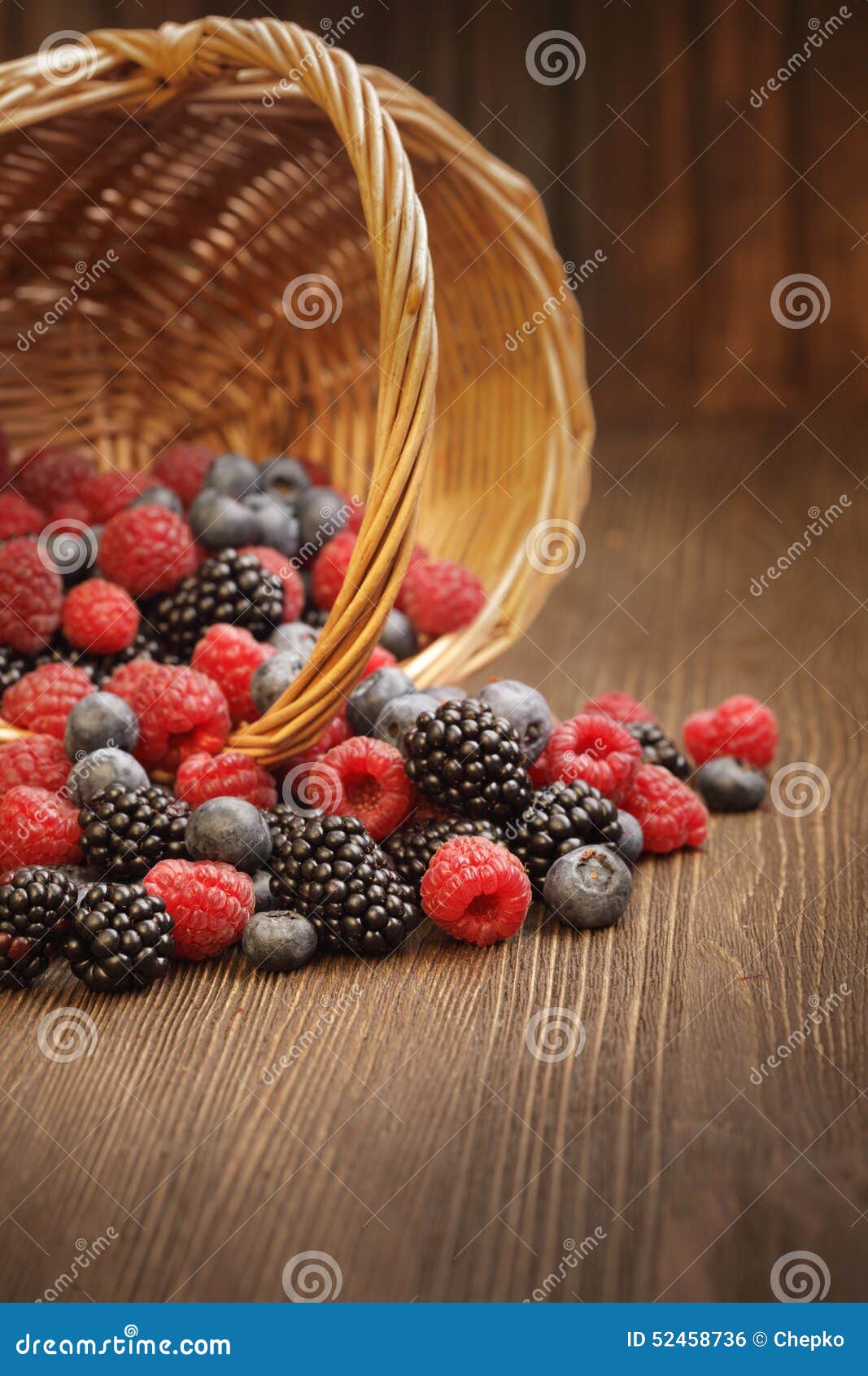 Different Berries in a Basket on a Wooden Table Stock Photo - Image of ...