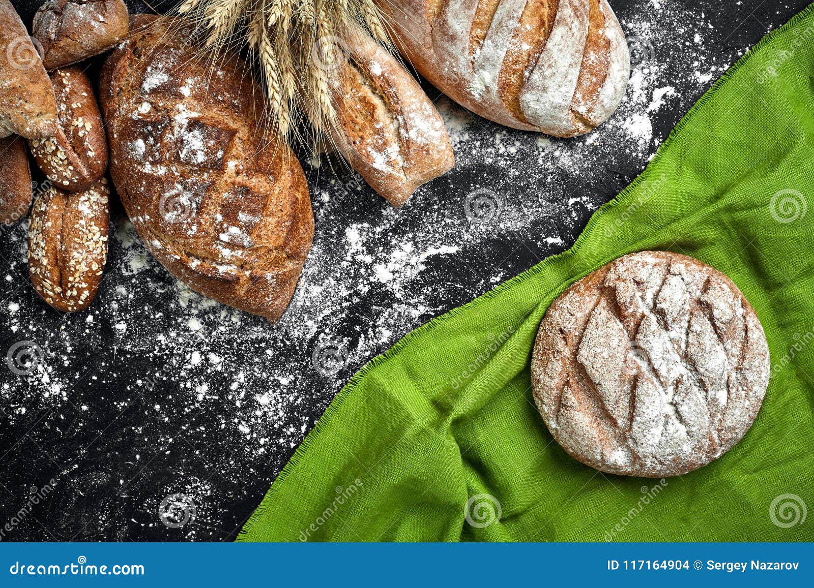 Different Bread with Flour and Spikelets of Wheaton Black Background ...