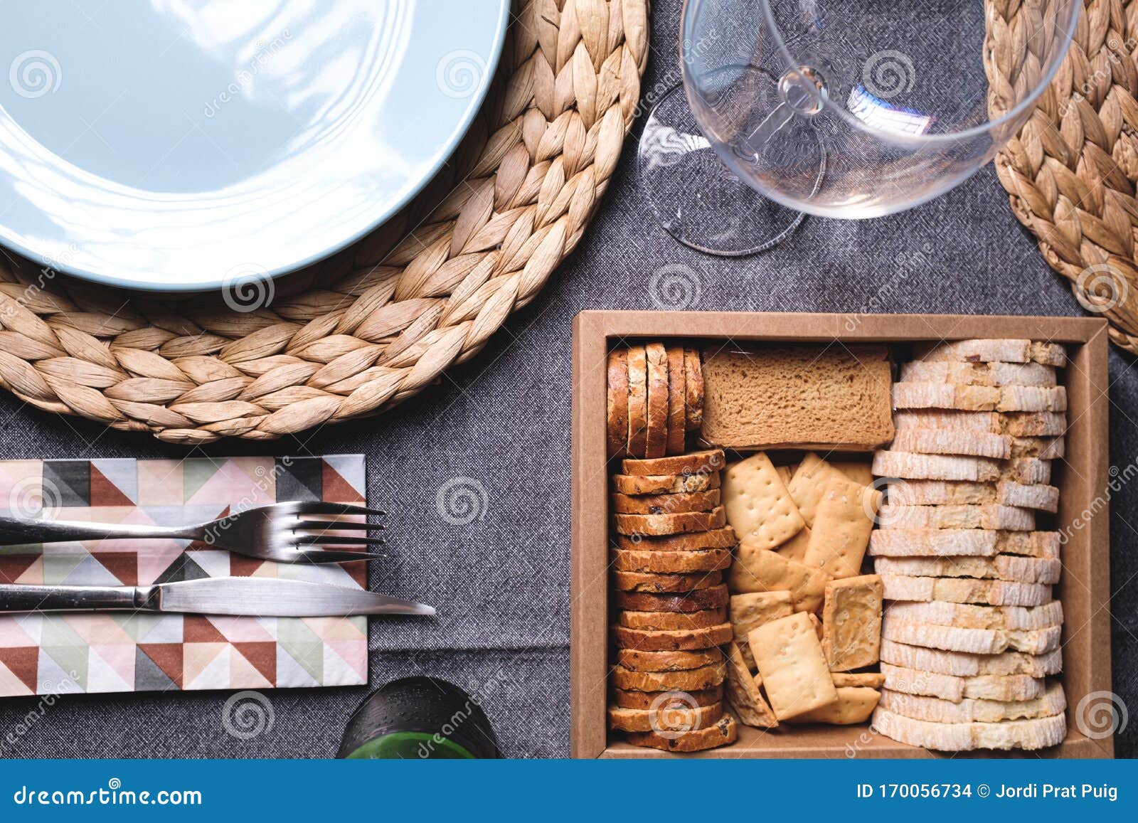 Different Bread Toast on a Box on a Served Dining Table with Blue ...