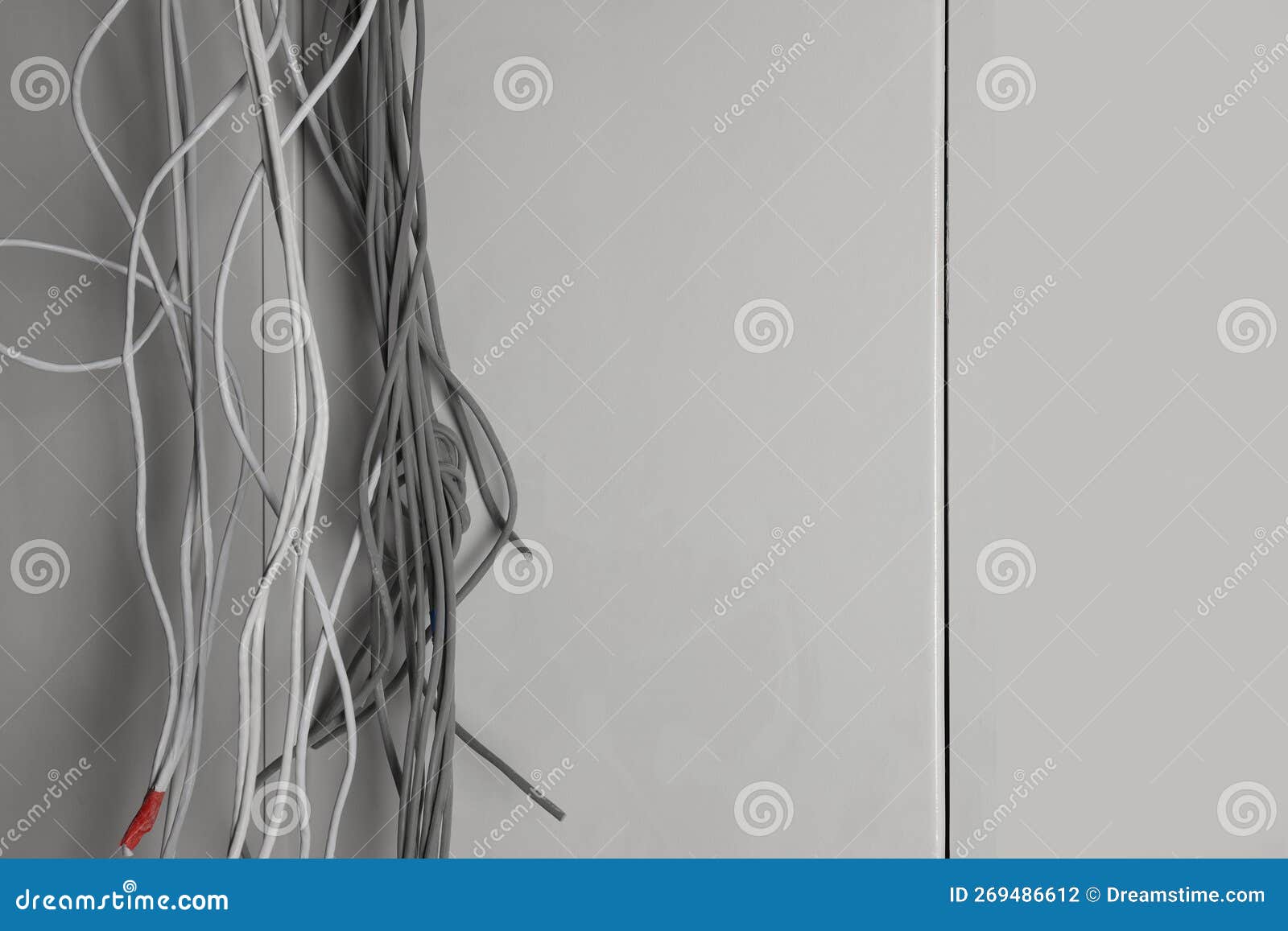 Different Cables on White Wall Indoors. Installation of Electrical ...