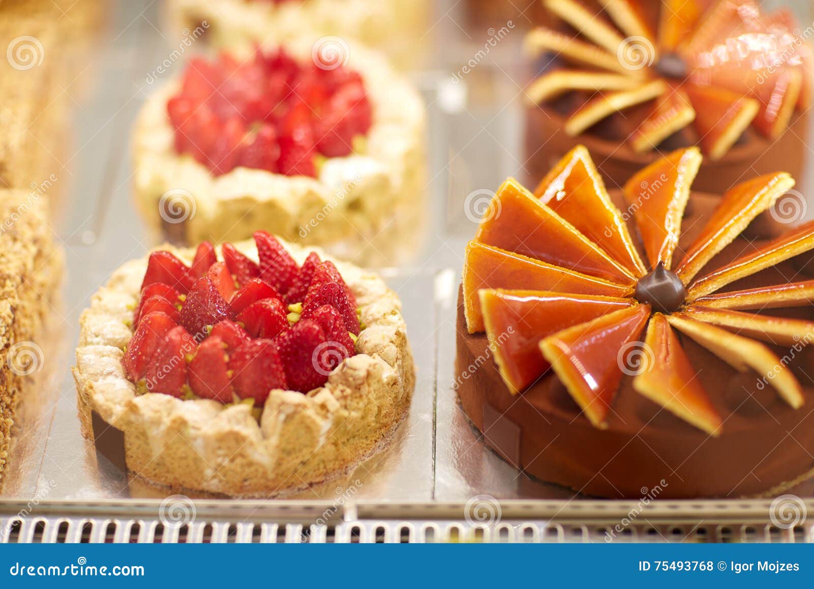 Different Cakes in Display Case in Pastry Shop Stock Photo - Image of ...