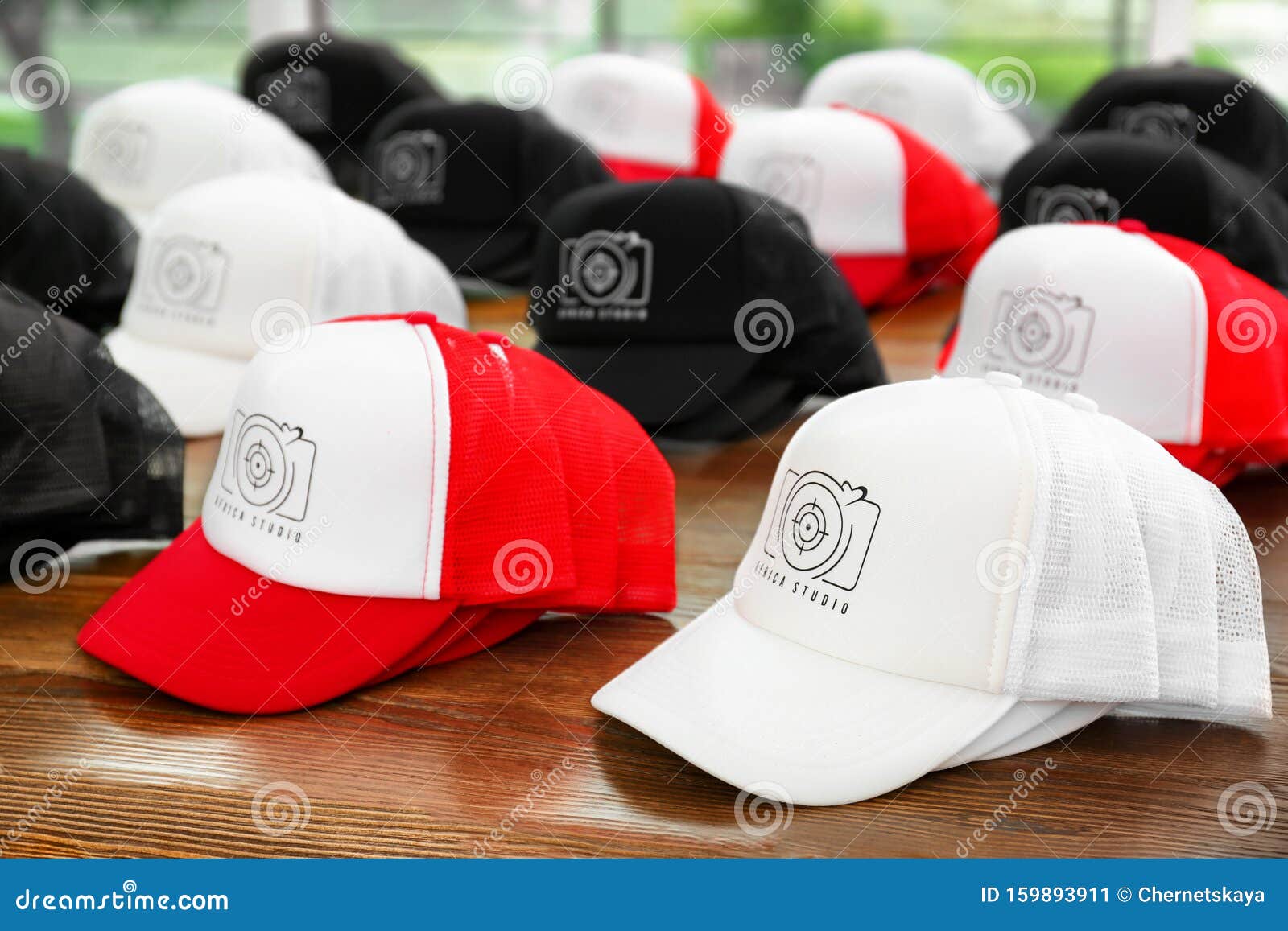 Different Caps with Logo on Table Stock Image - Image of retail ...
