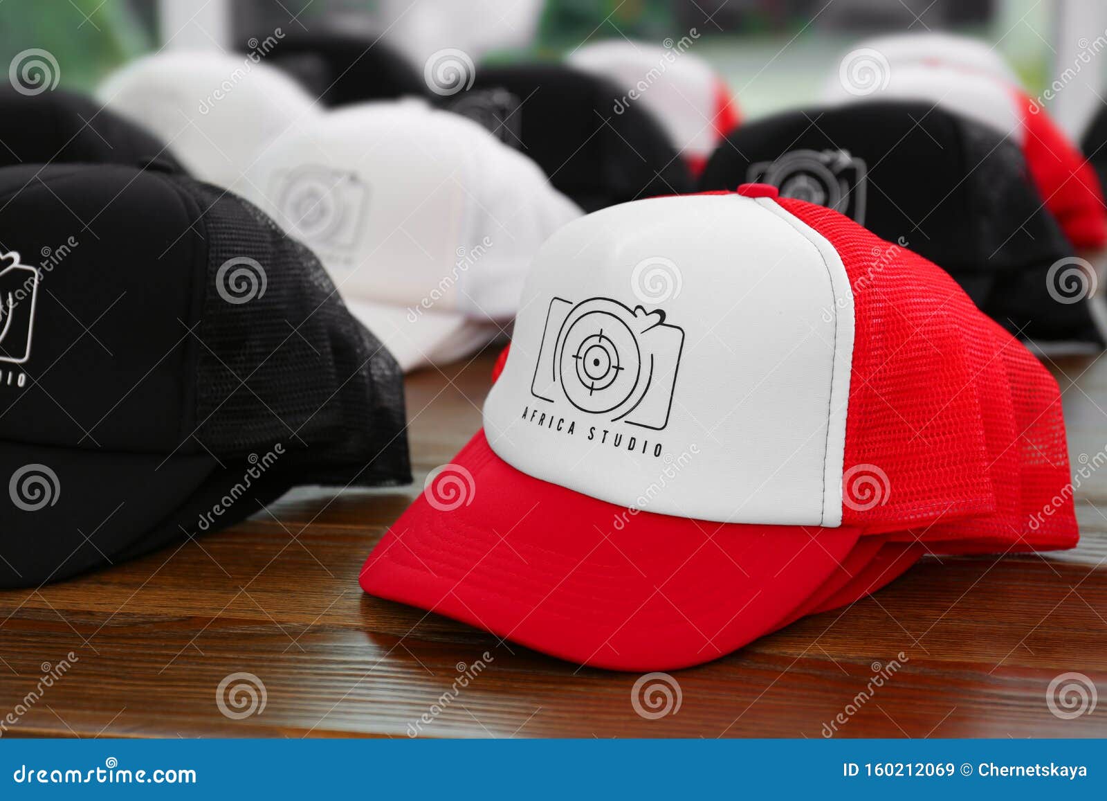 Different Caps With Logo On Wooden Shelf Editorial Photo ...