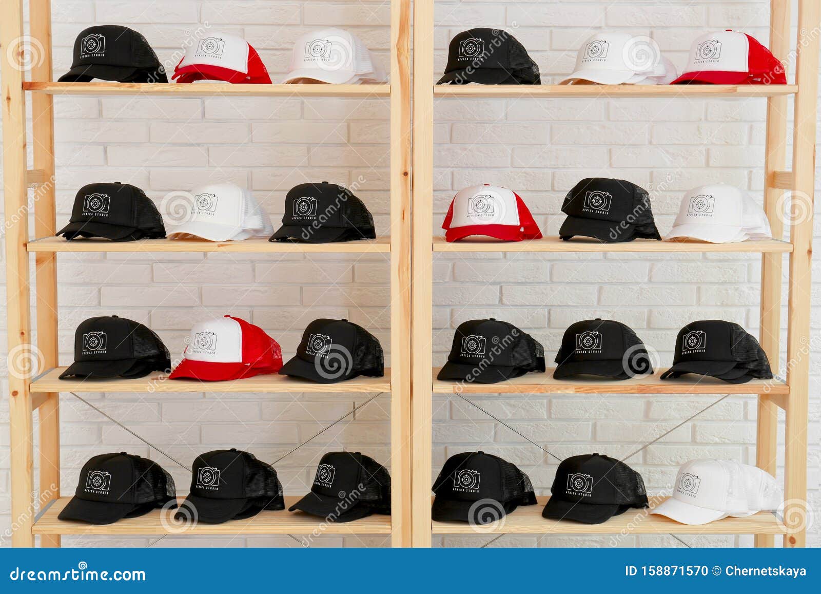 Different Caps with Logo on Wooden Rack Stock Photo - Image of identity ...