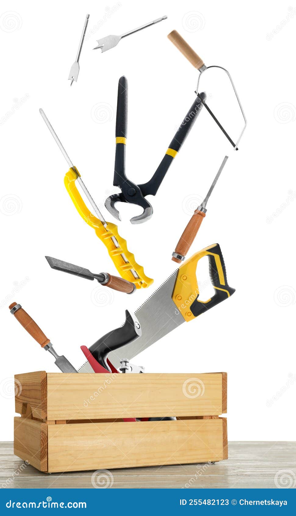 Different Carpenter`s Tools Falling into Wooden Box on White Background ...
