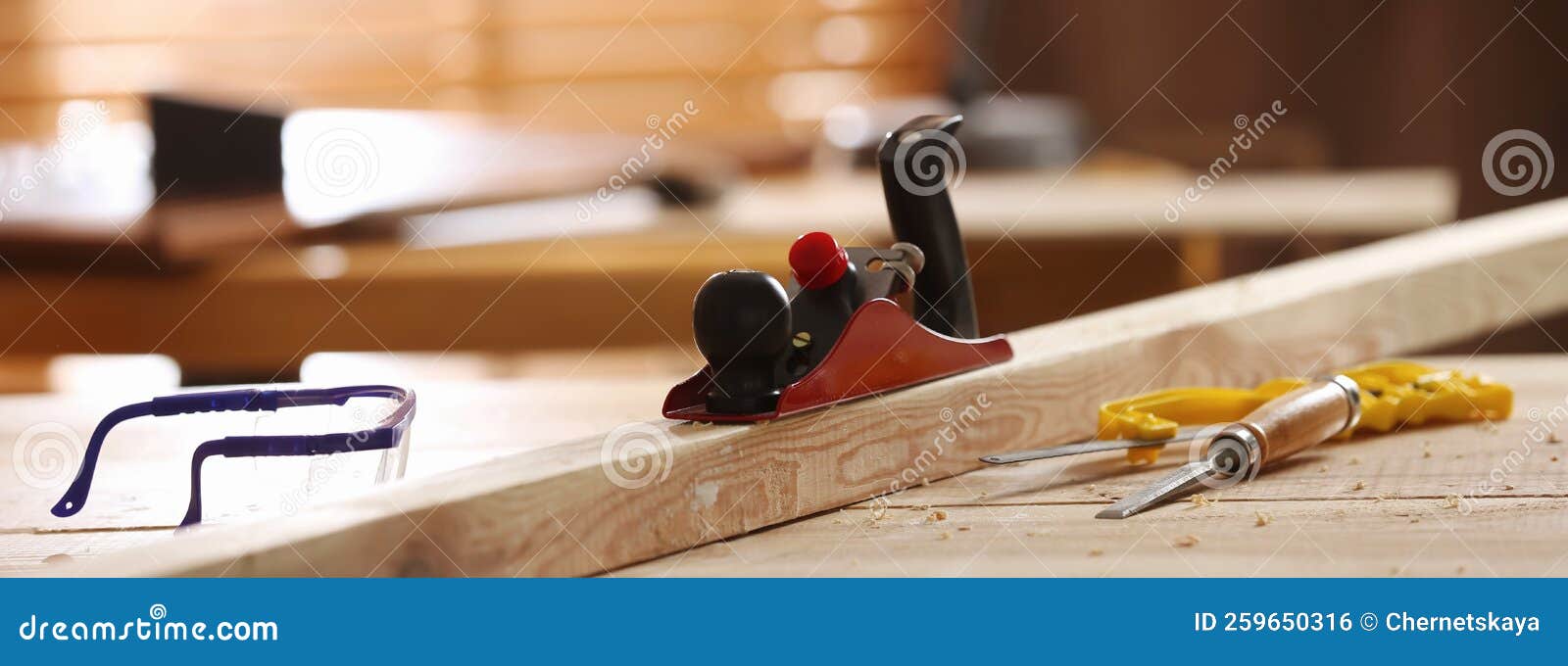 Different Carpenter`s Tools and Wooden Bar on Table in Workshop. Banner ...