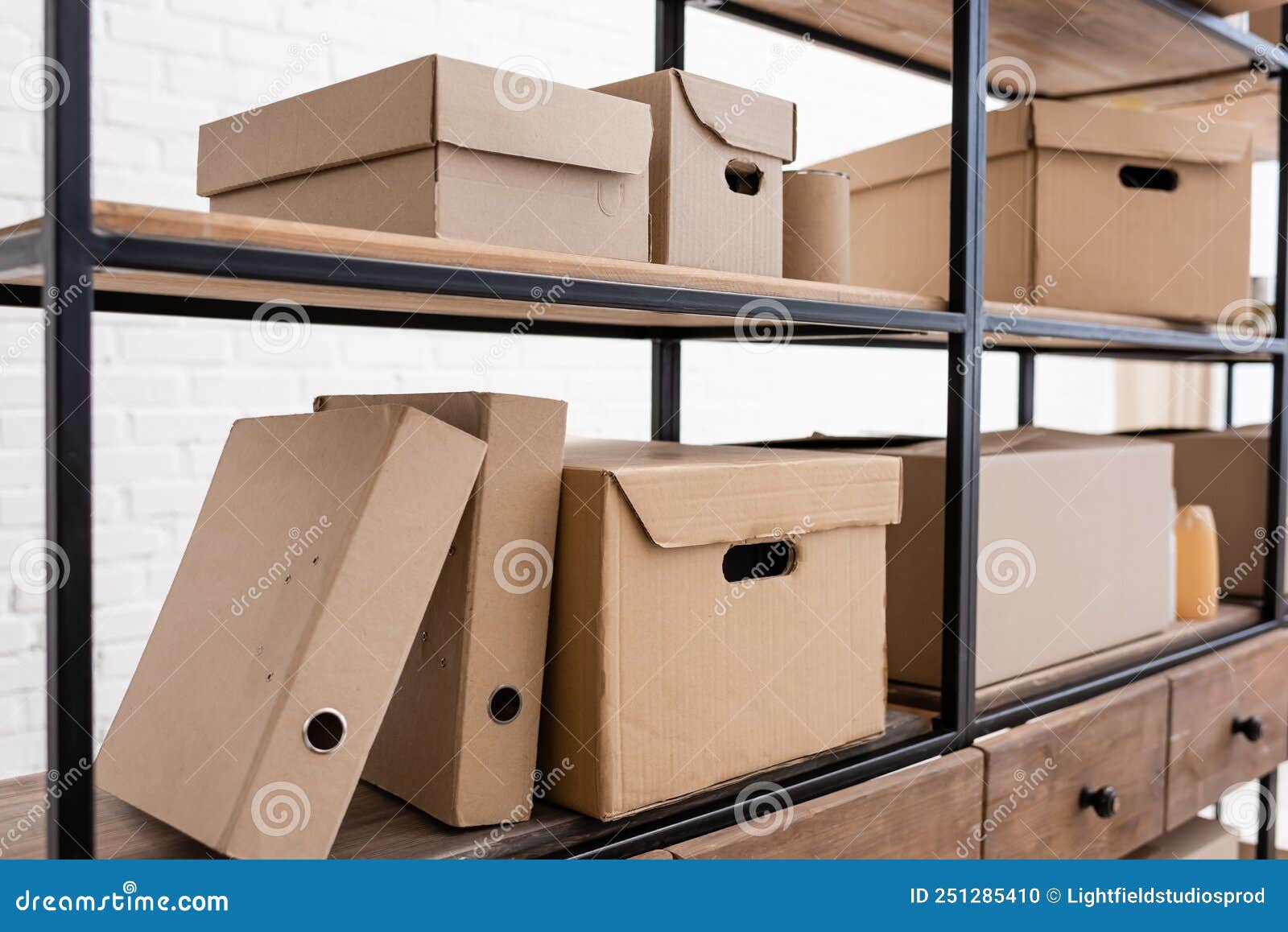 Different Carton Packages on Rack in Stock Photo - Image of variety ...