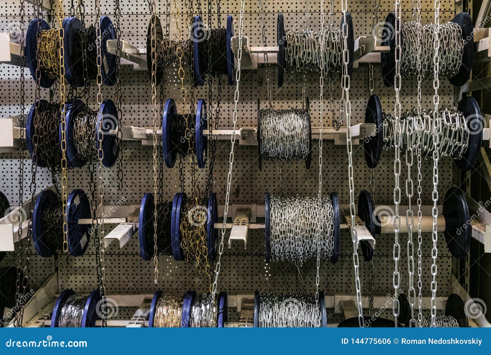 Different Chains in Roll Coils. Industrial Steel Chains on Market Stock ...