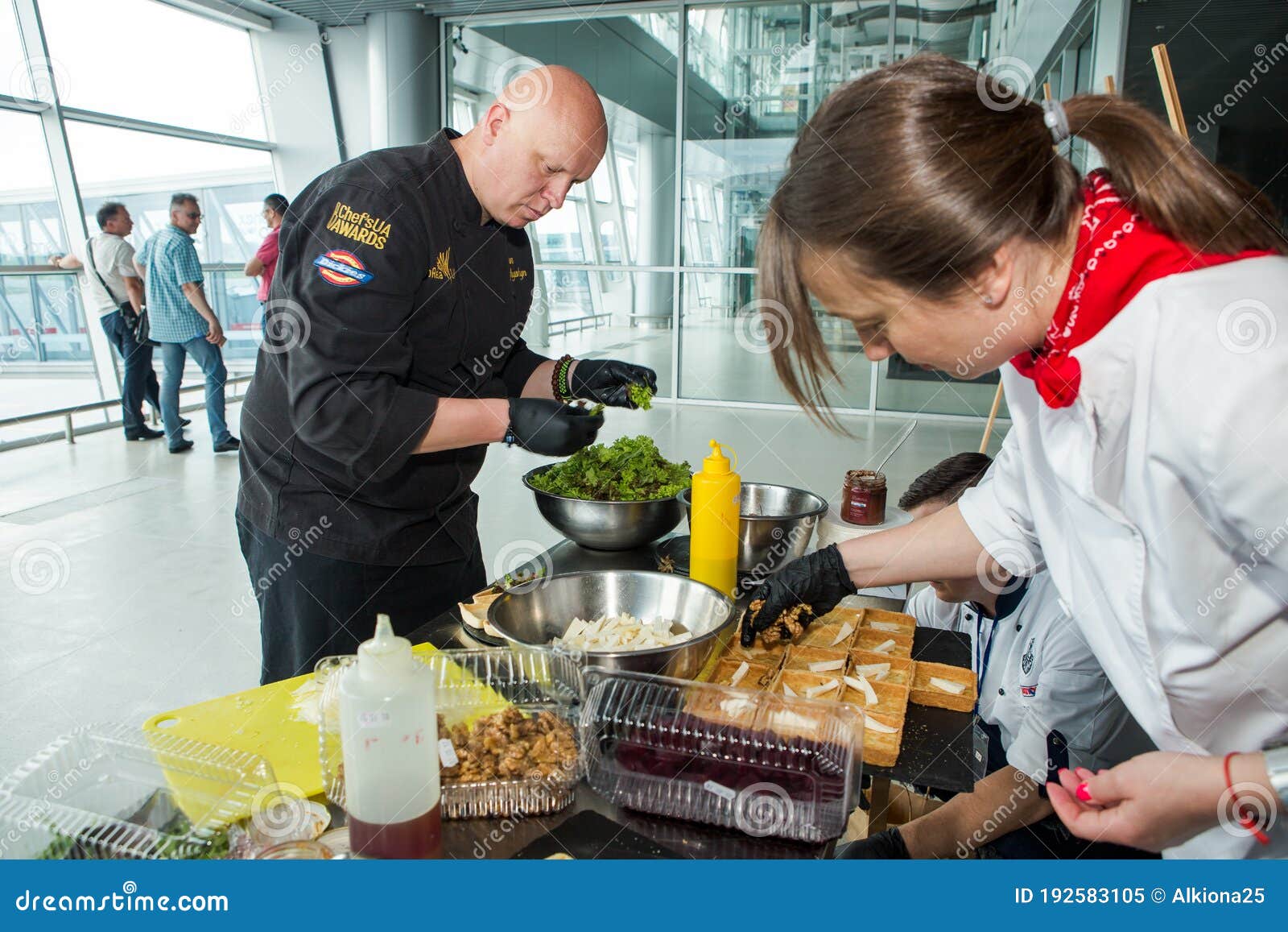 Different Chefs in Uniforms Serving Snacks on Table for Degustation in ...