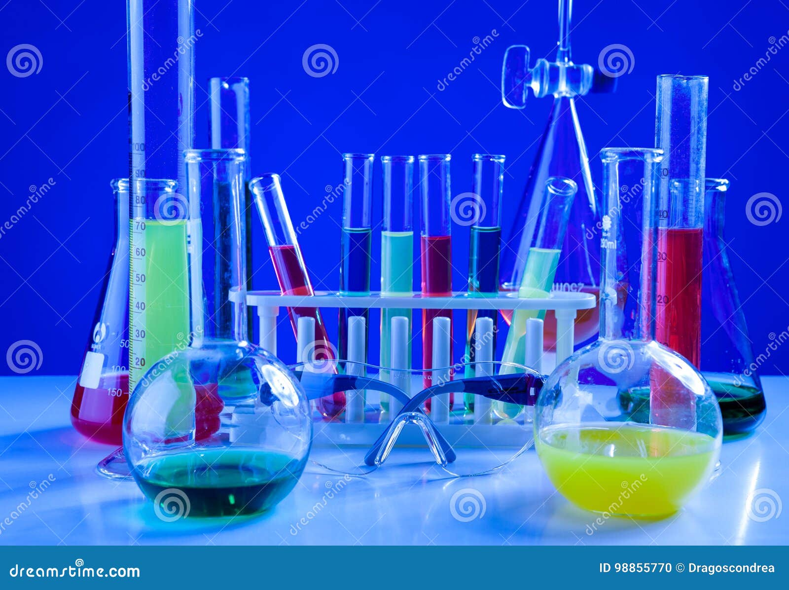 Different Chemistry Lab Set on a Table Over Blue Background Stock Photo ...