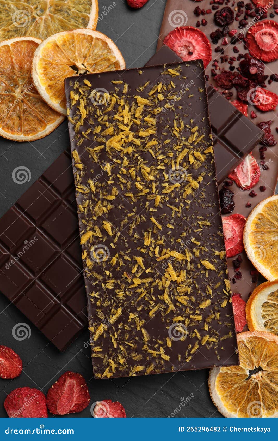 Different Chocolate Bars with Freeze Dried Fruits on Slate Table, Flat ...