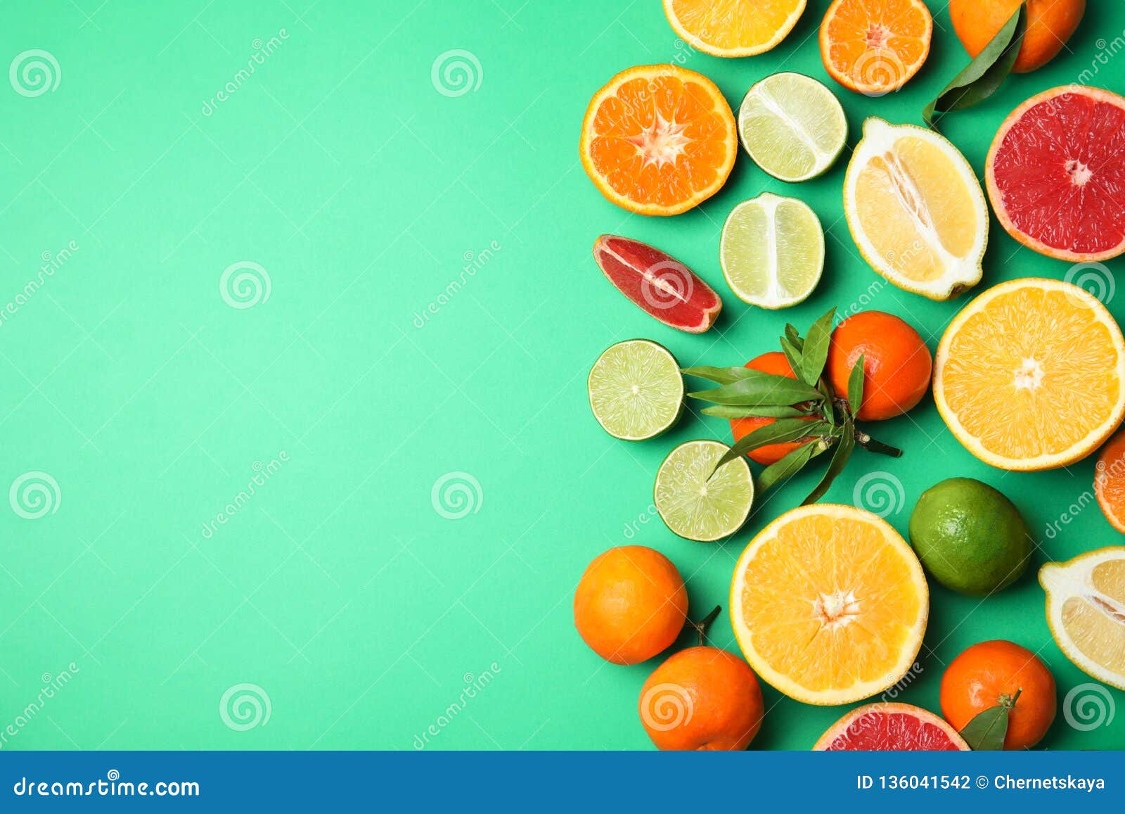 Different Citrus Fruits on Color Background, Top View. Stock Photo ...