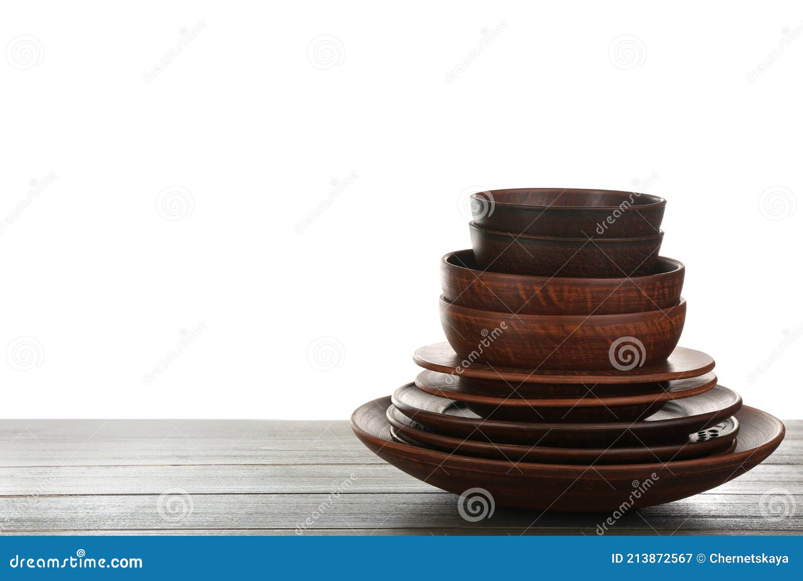 Different Clay Dishware on Wooden Table Against White Background Stock ...