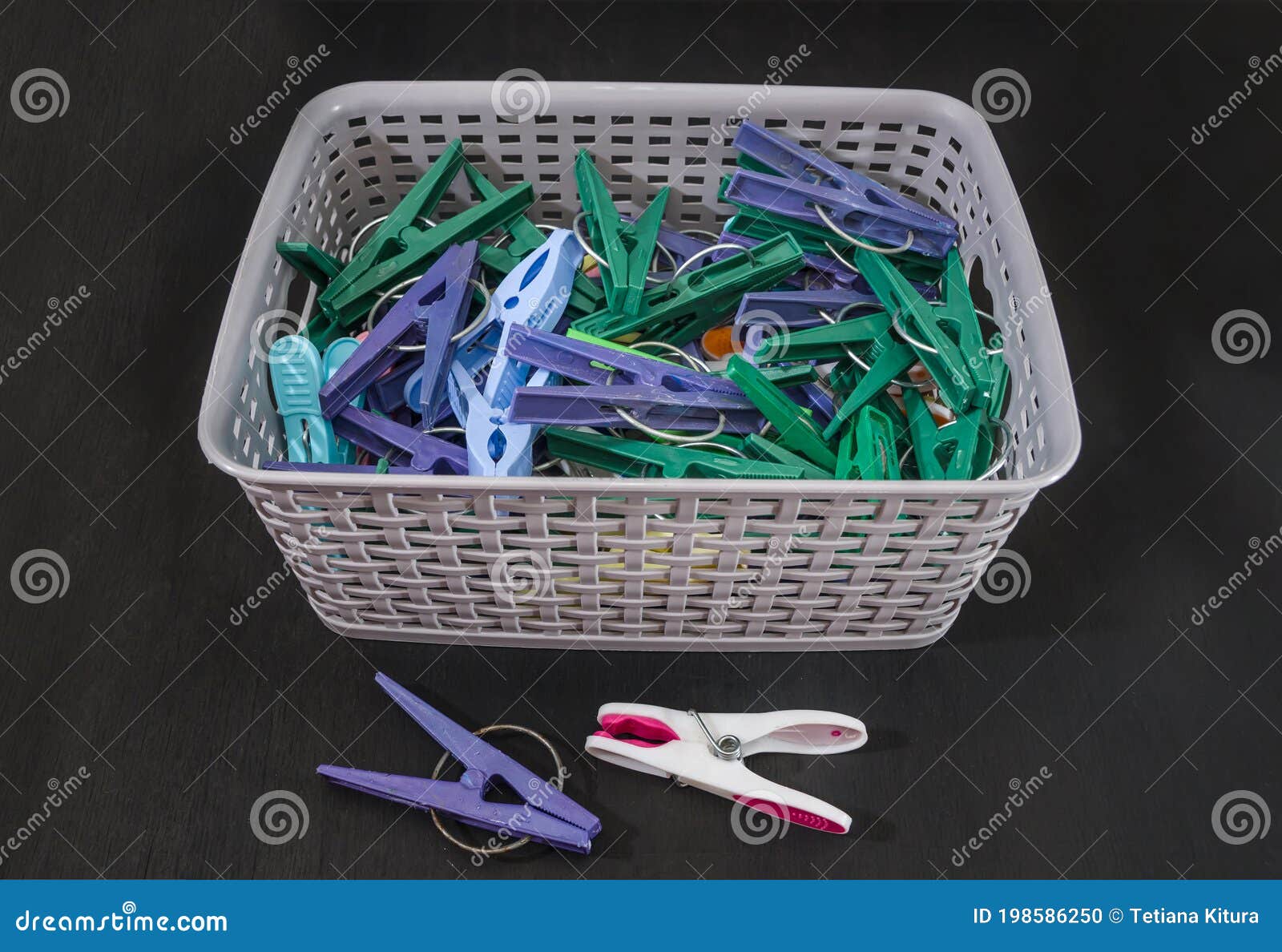 Different Clothespins in a Basket on a Black Background. Stock Photo ...