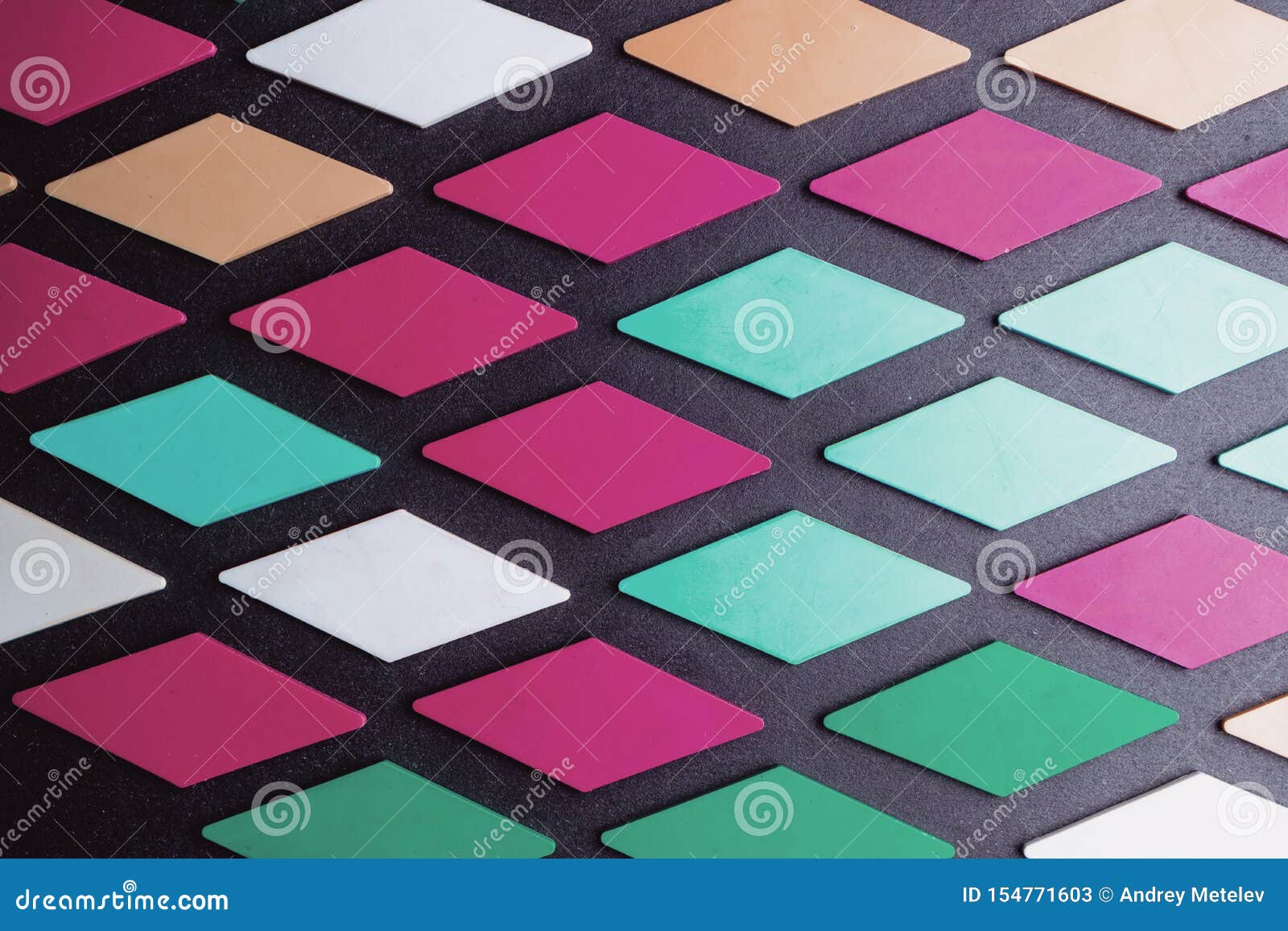 Different Color Figures in the Form of Rhomb are Located on a Black ...