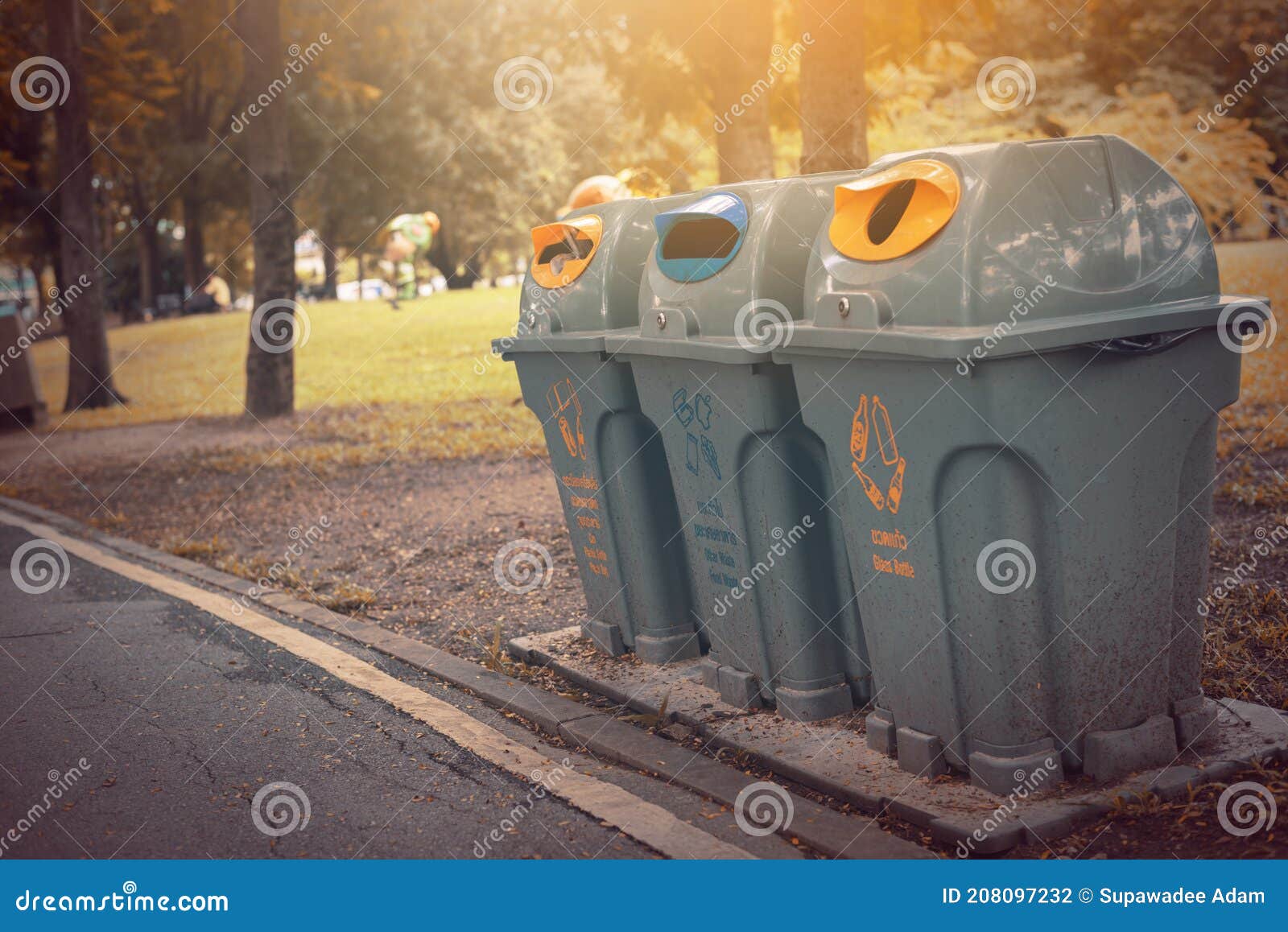 Different Colored Bins for Collection of Recycle Materials in the Park ...