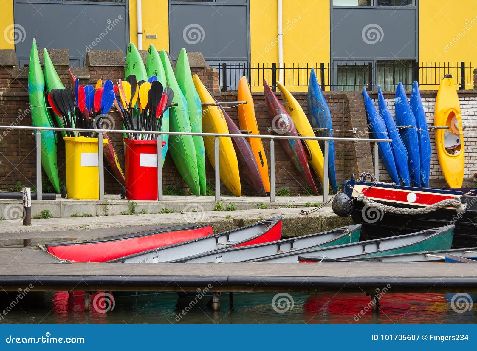 Different colored canoes stock image. Image of upright - 101705607