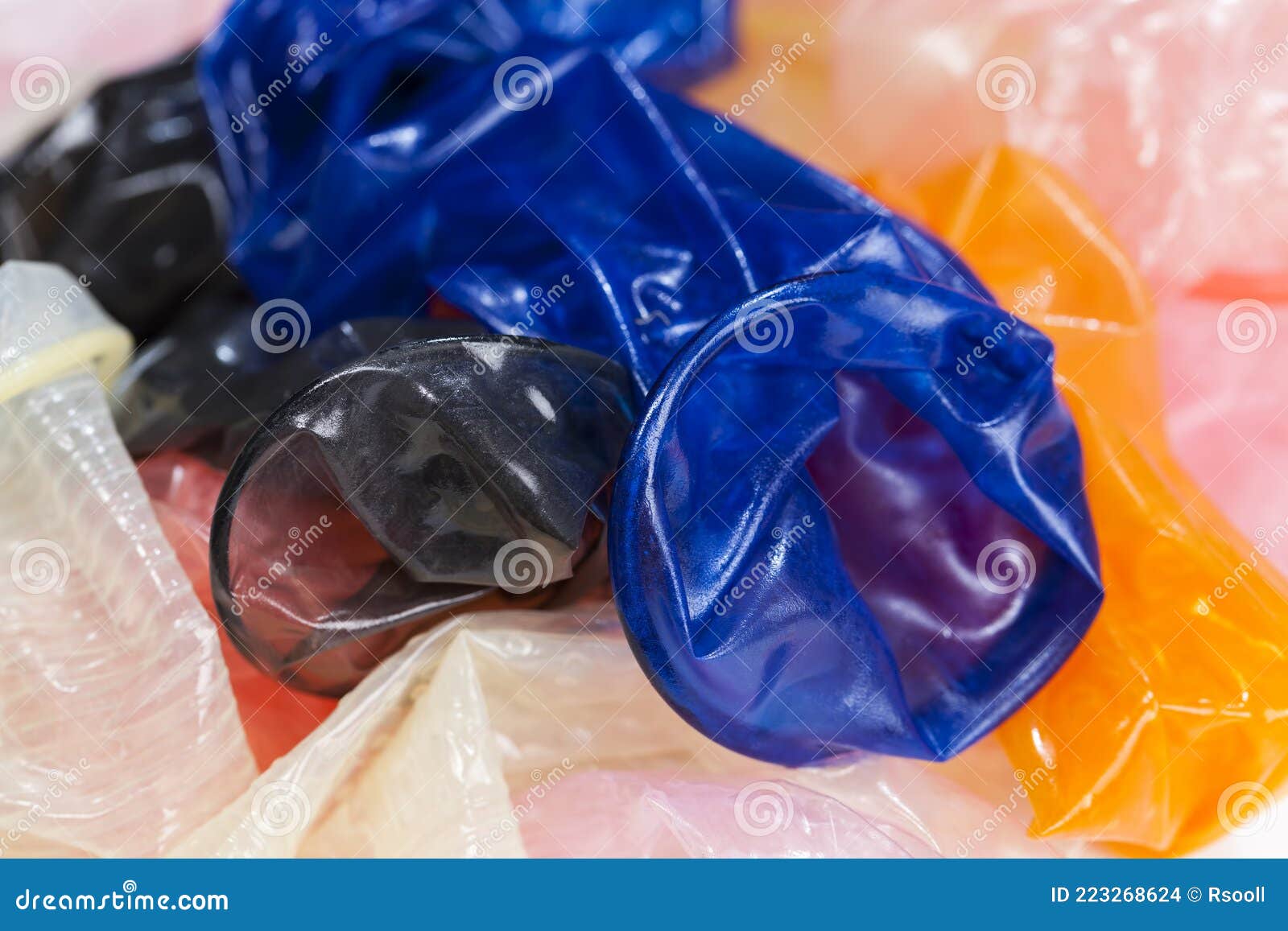 Different colored condoms stock photo. Image of happy - 223268624