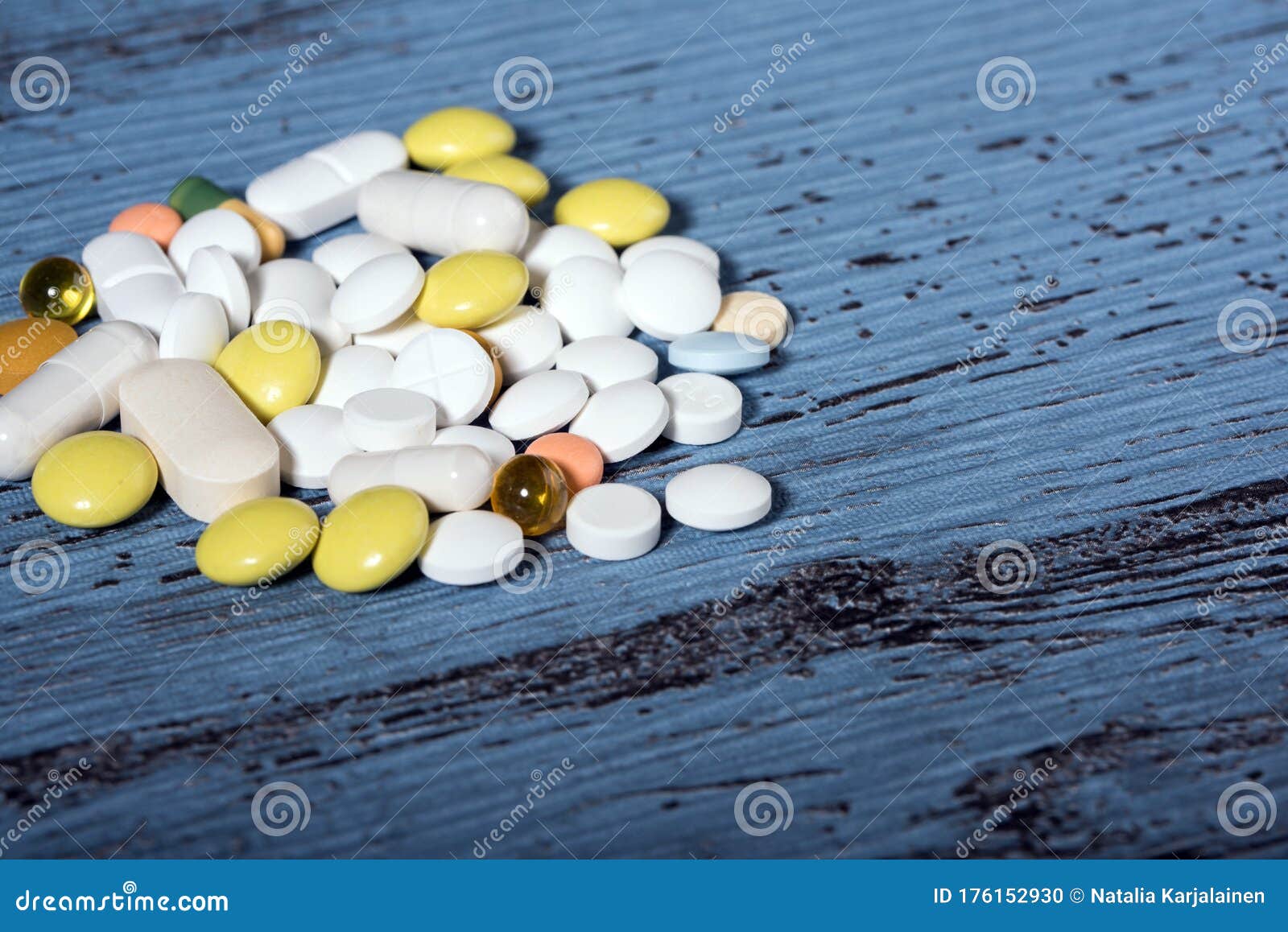 Different Colored Medications and Tablets on Blue Texture Background ...