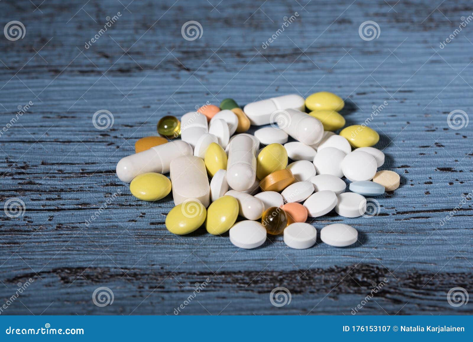 Different Colored Medications And Tablets On Blue Texture Background ...