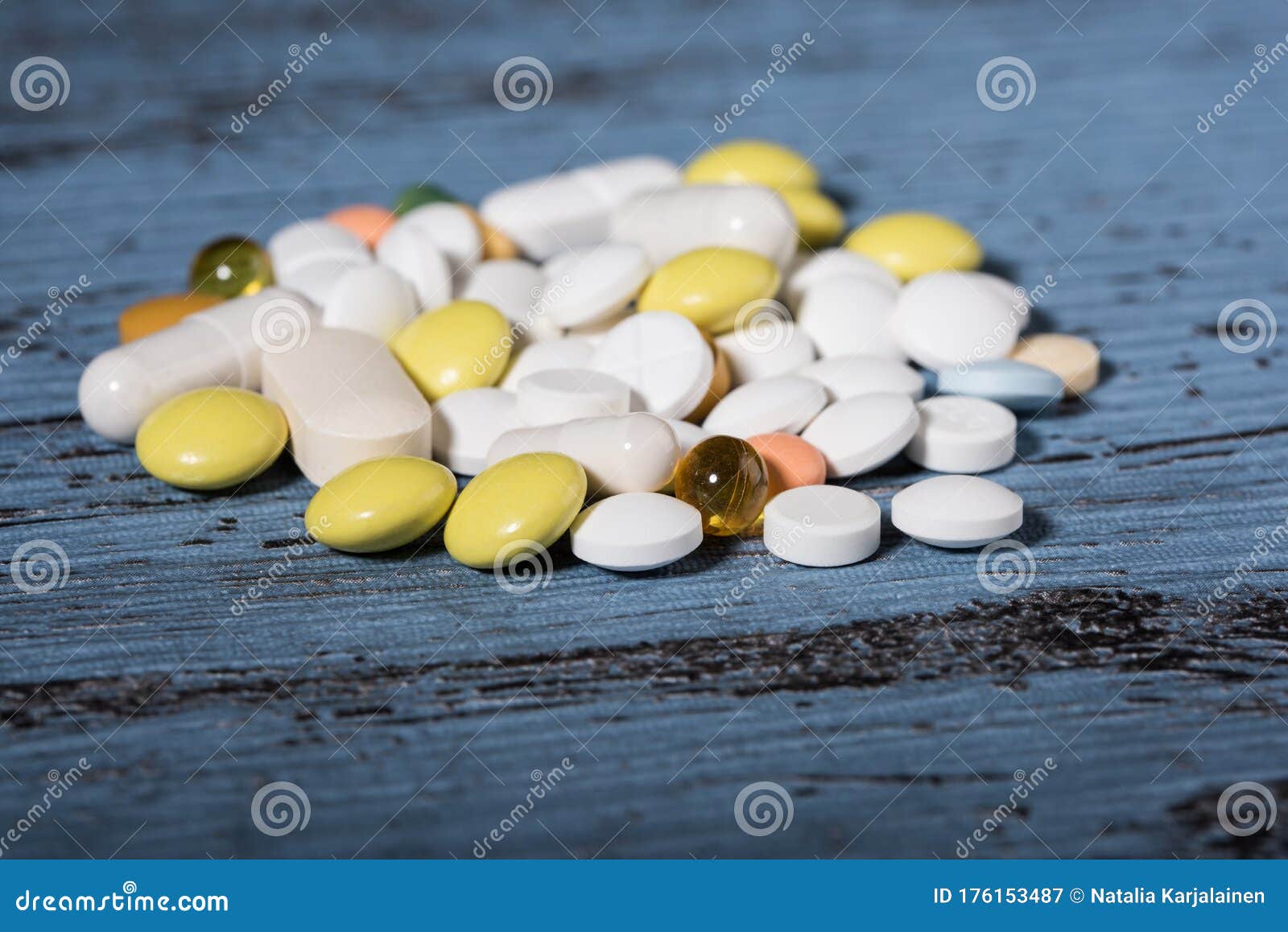 Different Colored Medications and Tablets on Blue Texture Background ...