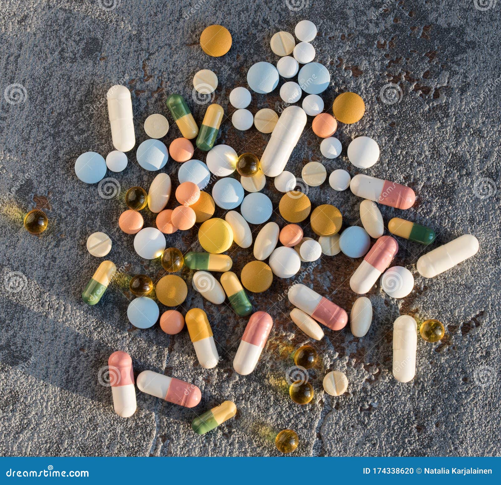 Different Colored Medications and Tablets on Grey Texture Background ...