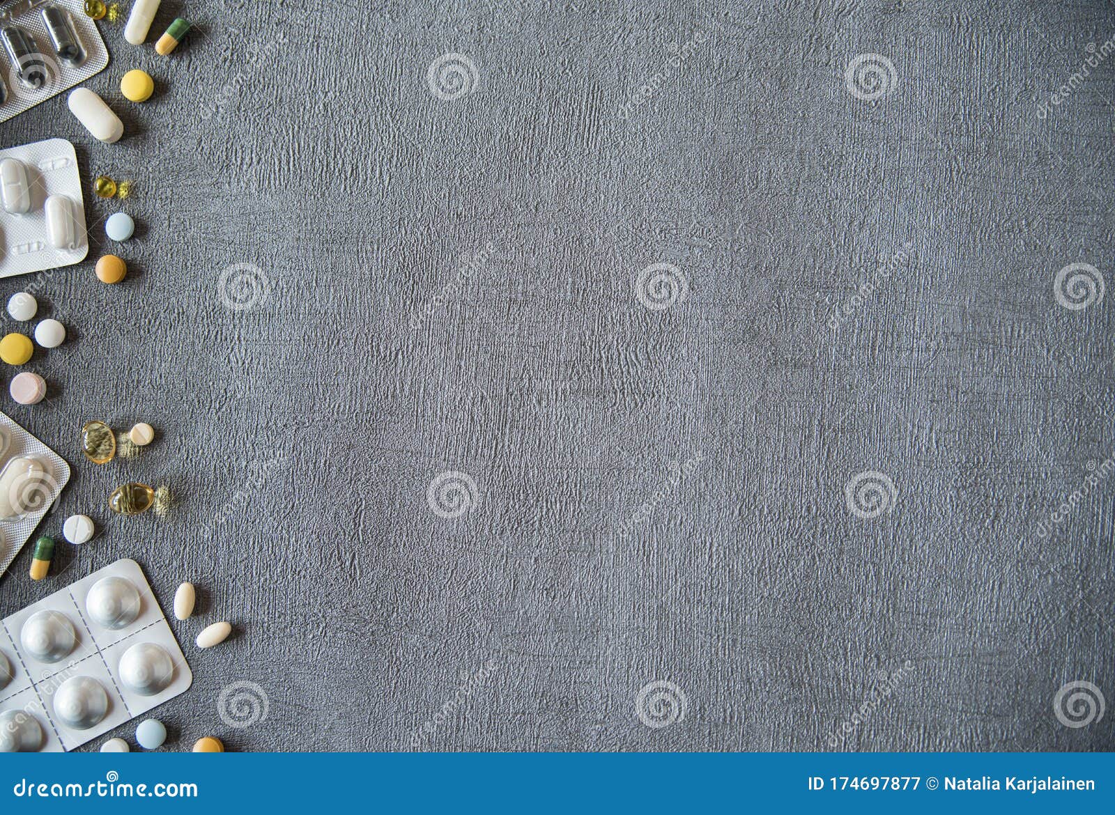 Different Colored Medications and Tablets on Grey Texture Background ...