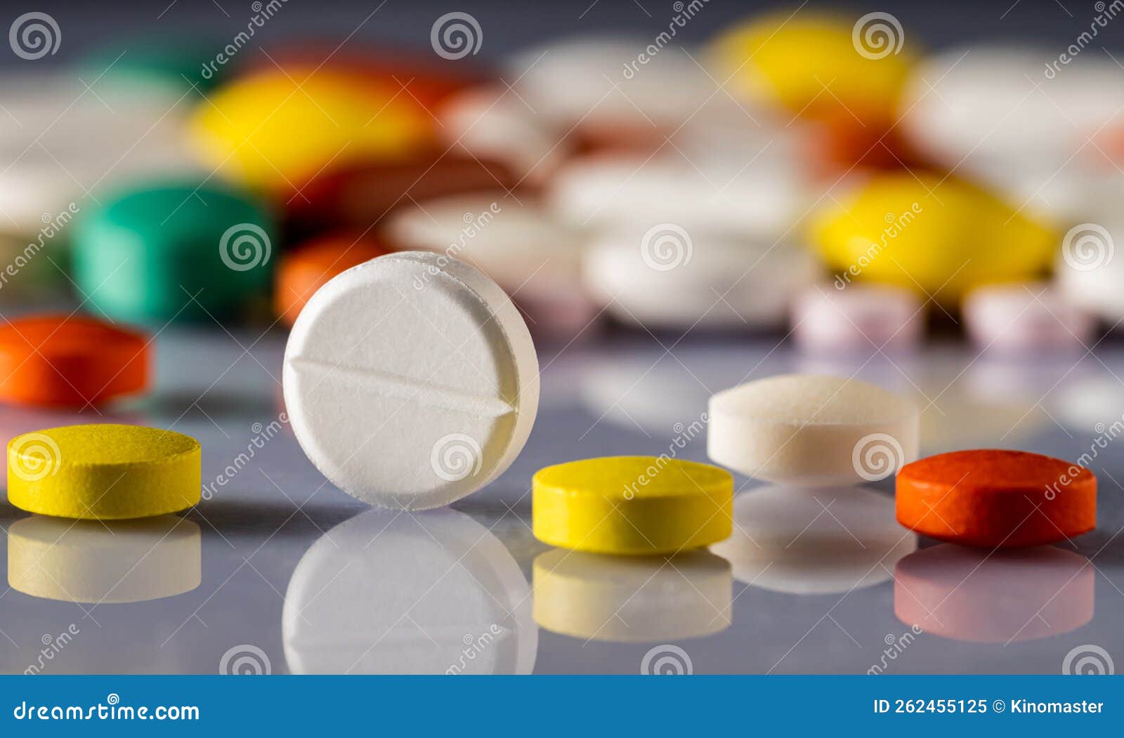 Different Colored Pills and Tablets Scattered on a Glossy Reflective ...