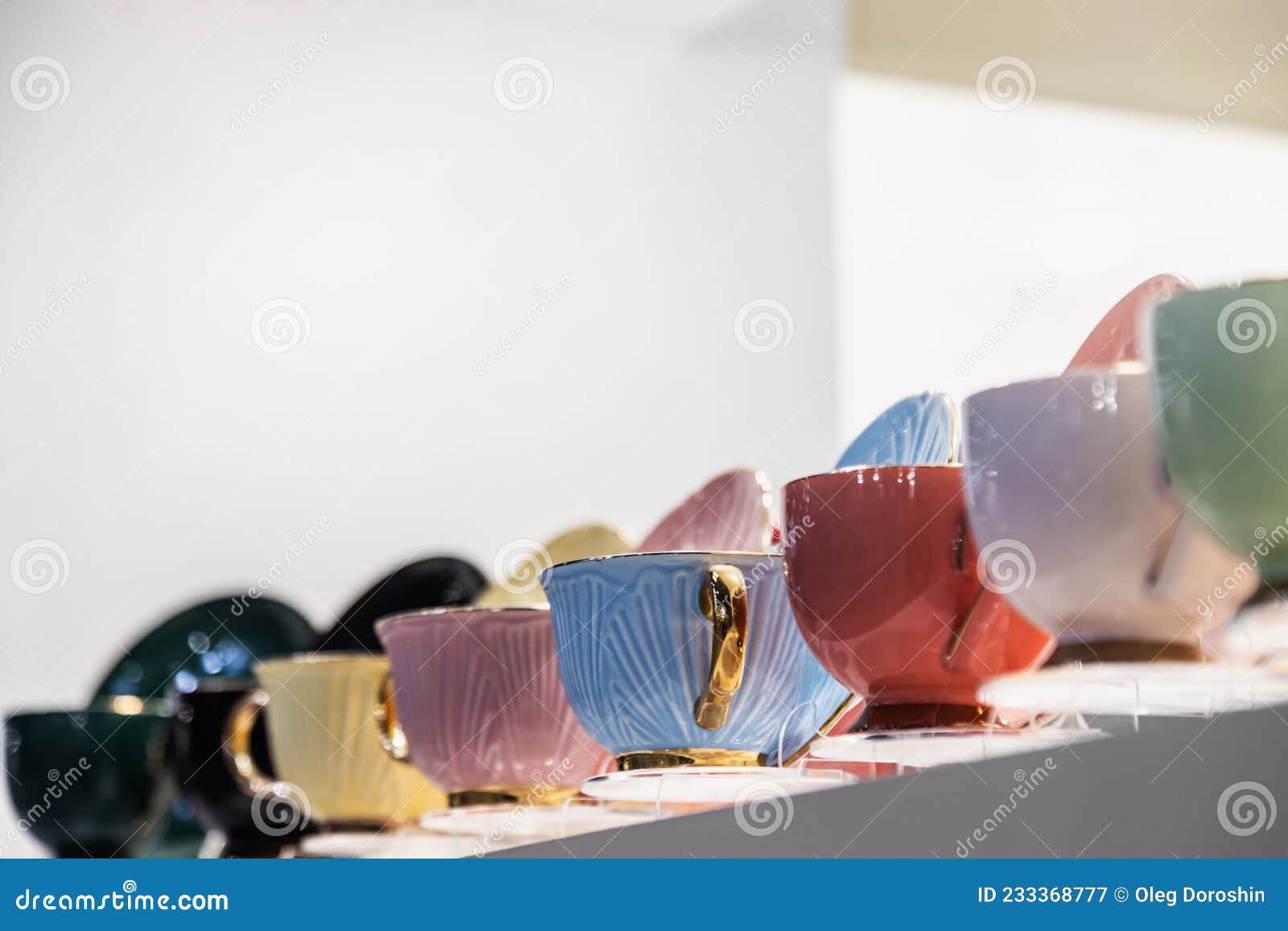Different-colored Porcelain Cups are on the Counter Stock Image - Image ...
