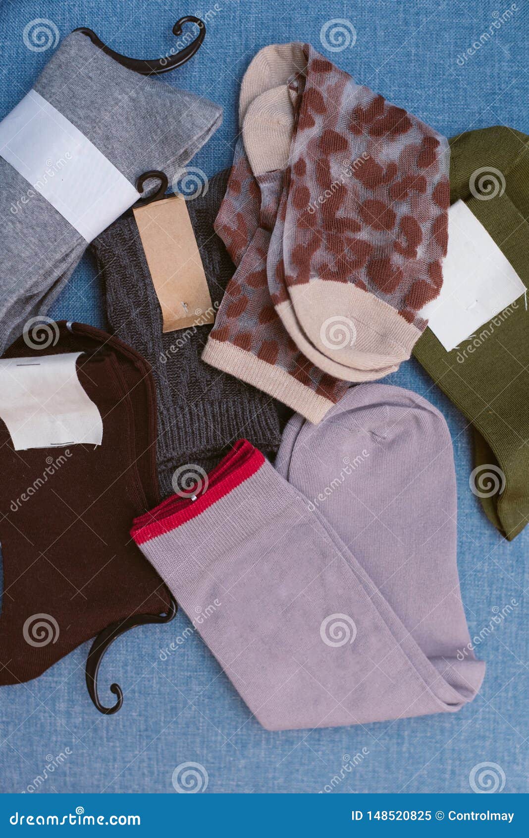Different Colored Stylish Socks on Blue Background Stock Image - Image ...
