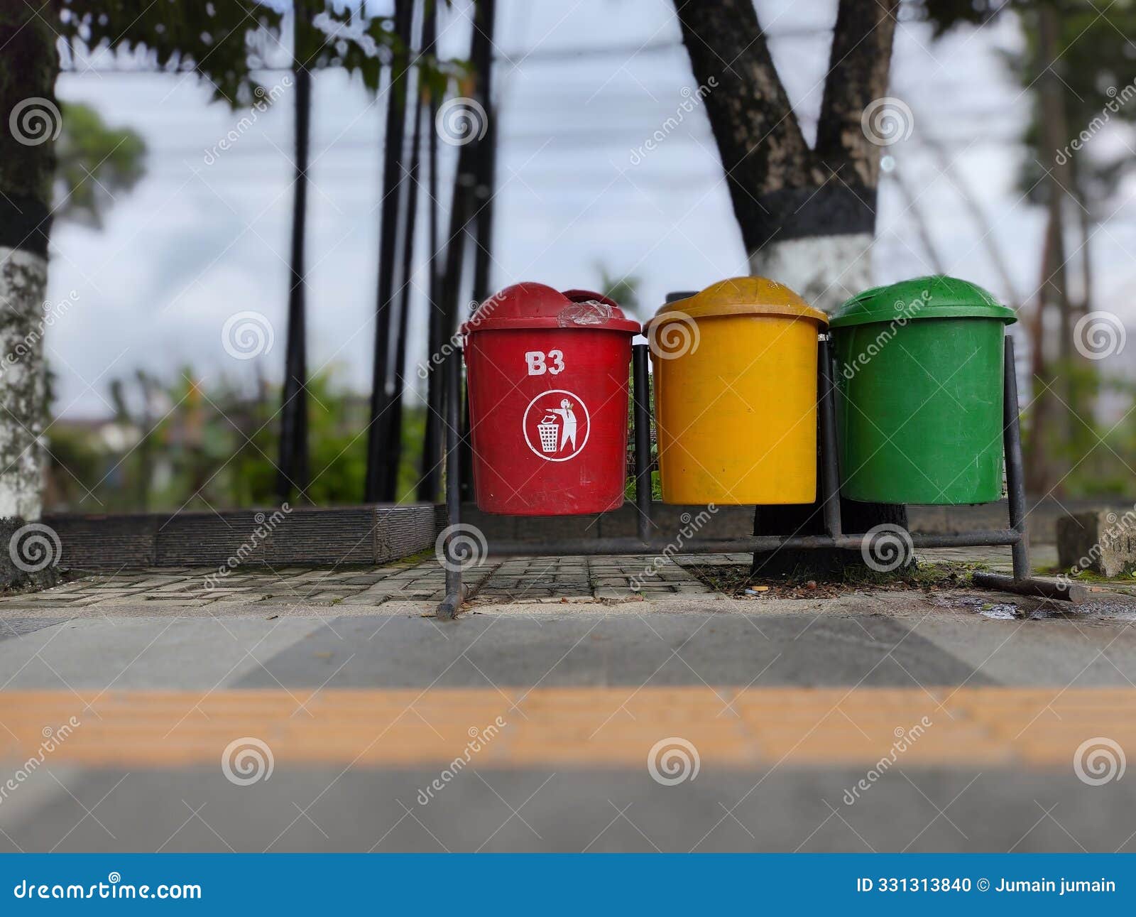 Different Colored Trash Cans in the Park. Separate Trash, Sort Waste To ...