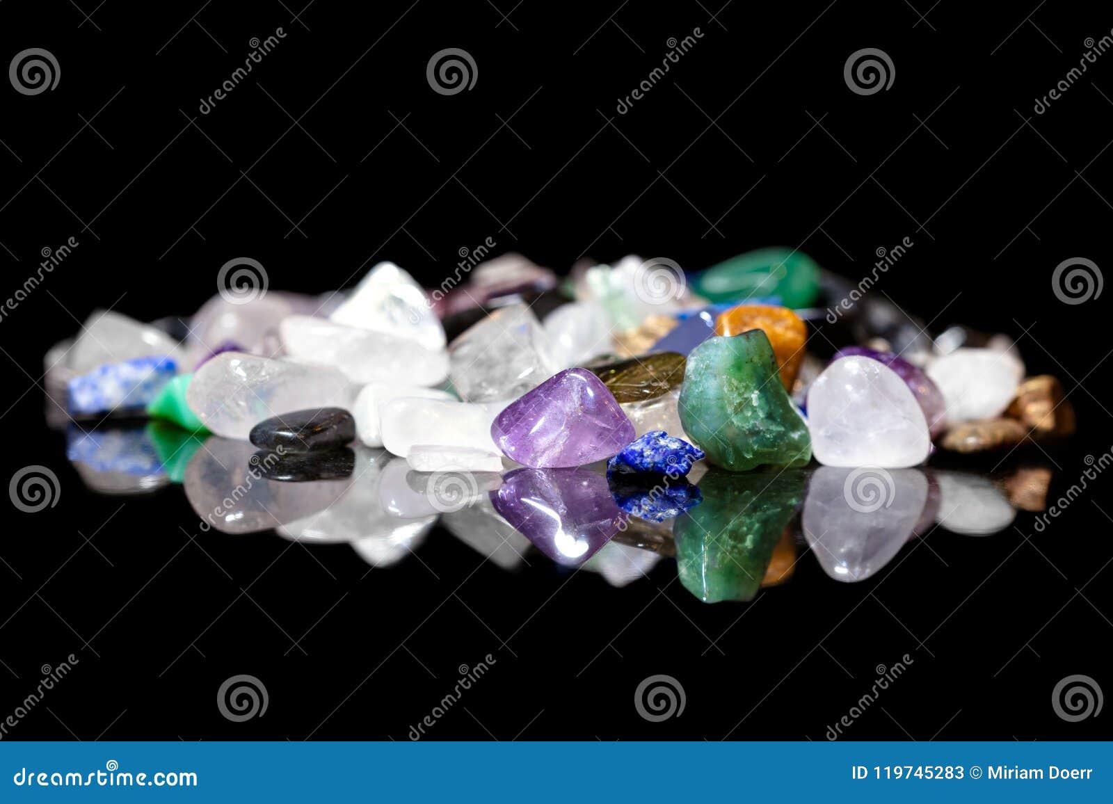 Different Colorful Rough Gems, Minerals and Crystals in Front of Stock ... Different Colorful Rough Gems, Minerals and Crystals in Front of Stock ...