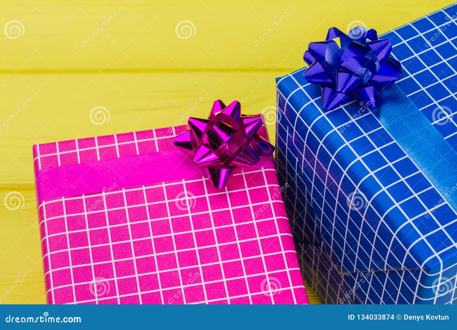 Different Colors Gift Boxes on Yellow Background. Stock Photo - Image ...