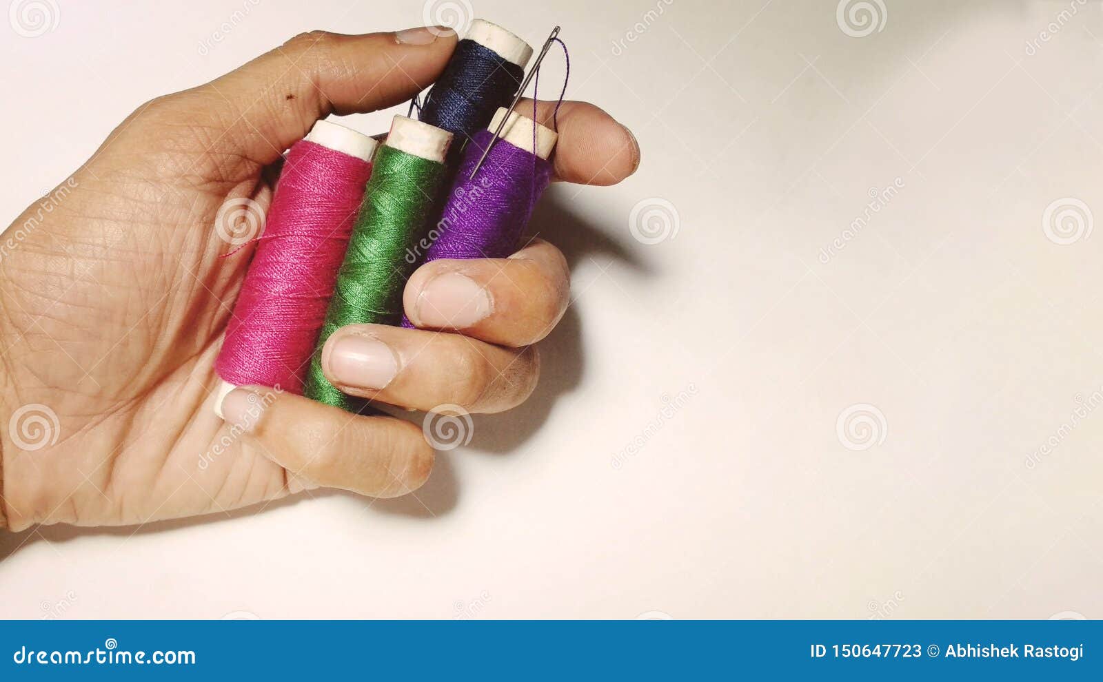 Different Colours Thread Rolls in Hand Stock Image - Image of color ...