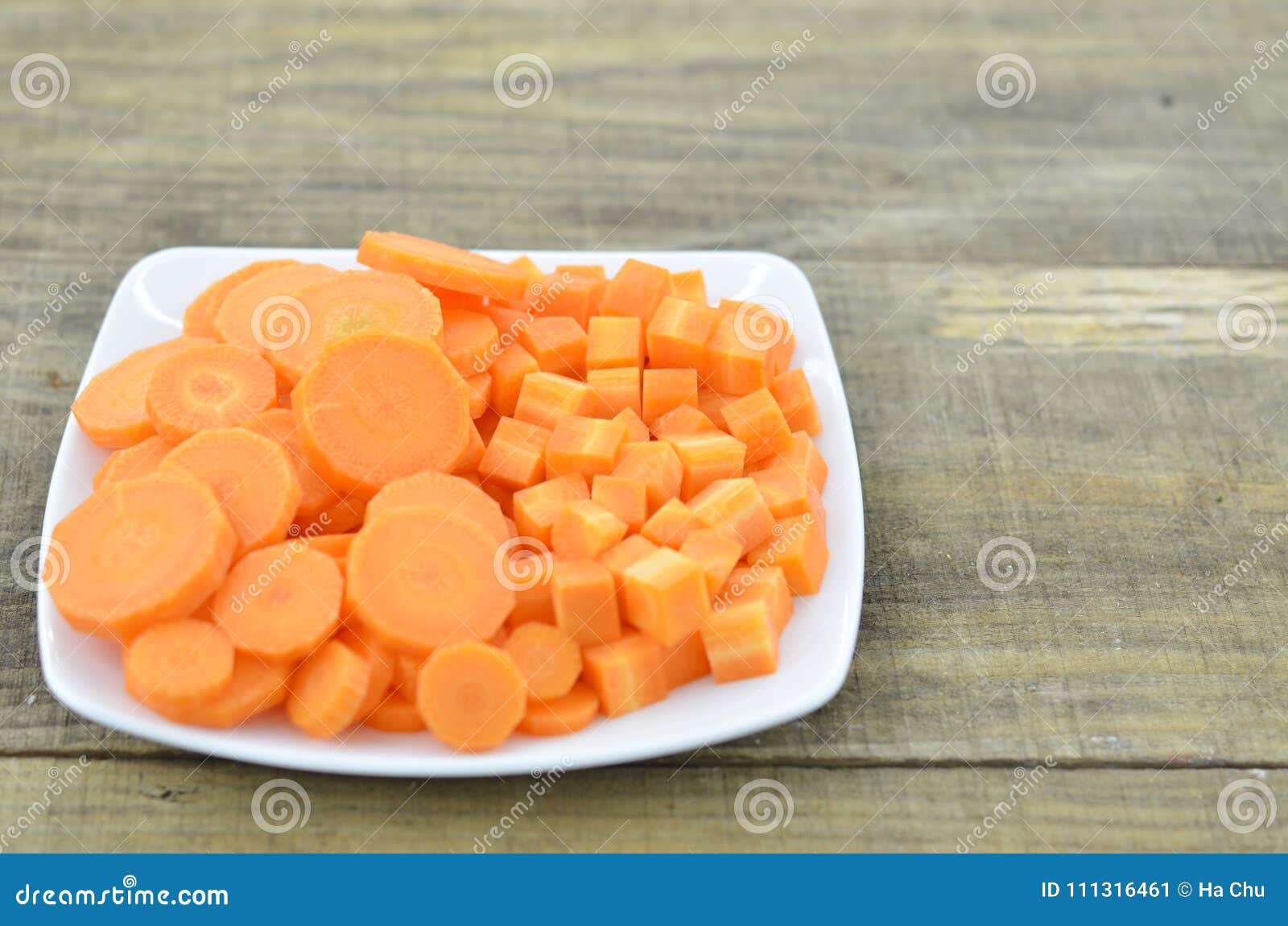 Different Cuts of Carrot in Plate on Wooden Background, Closeup Stock ...