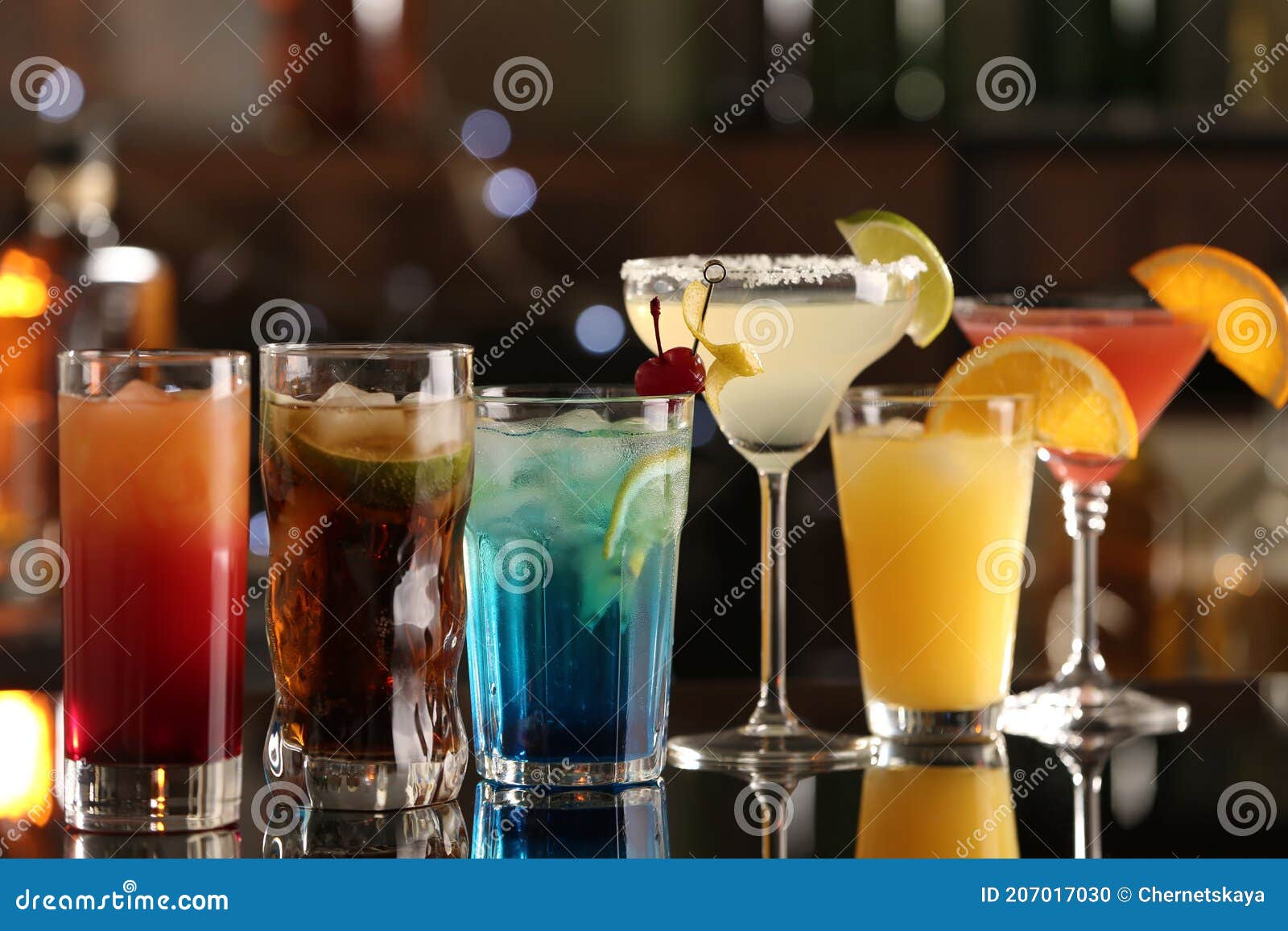 Different Delicious Cocktails on Counter in Bar Stock Photo - Image of ...