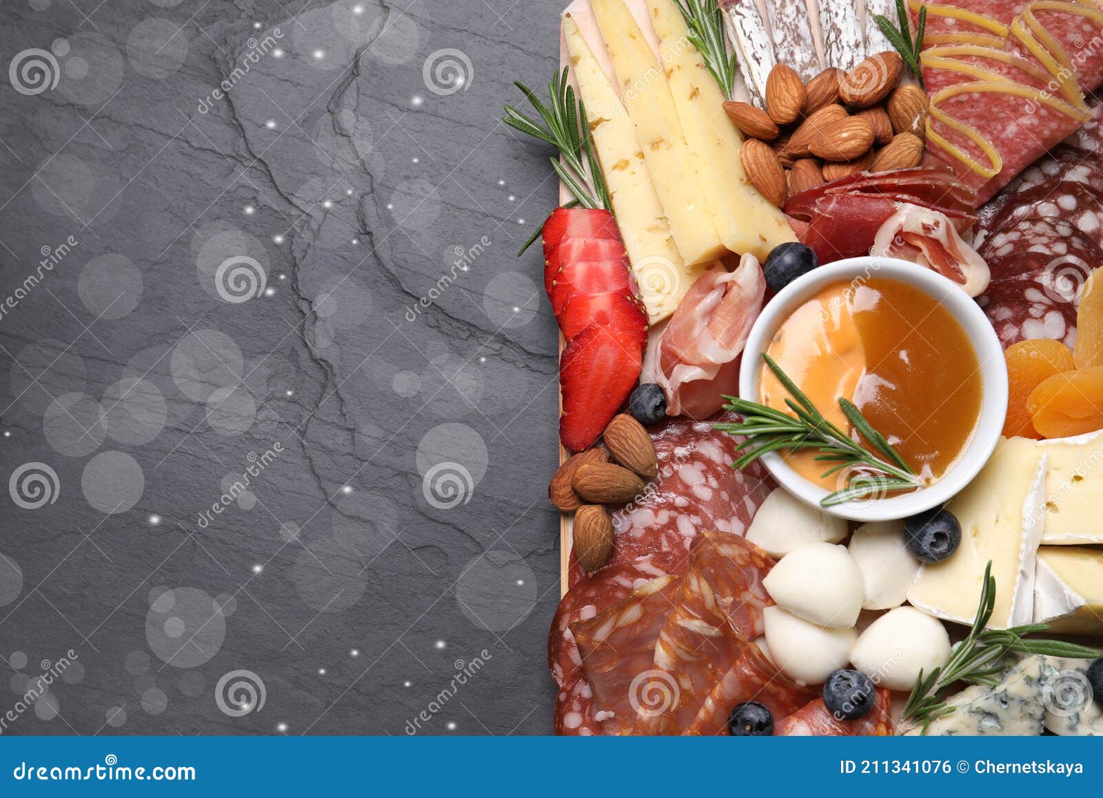 Different Delicious Snacks on Black Table, Top View. Space for Text ...