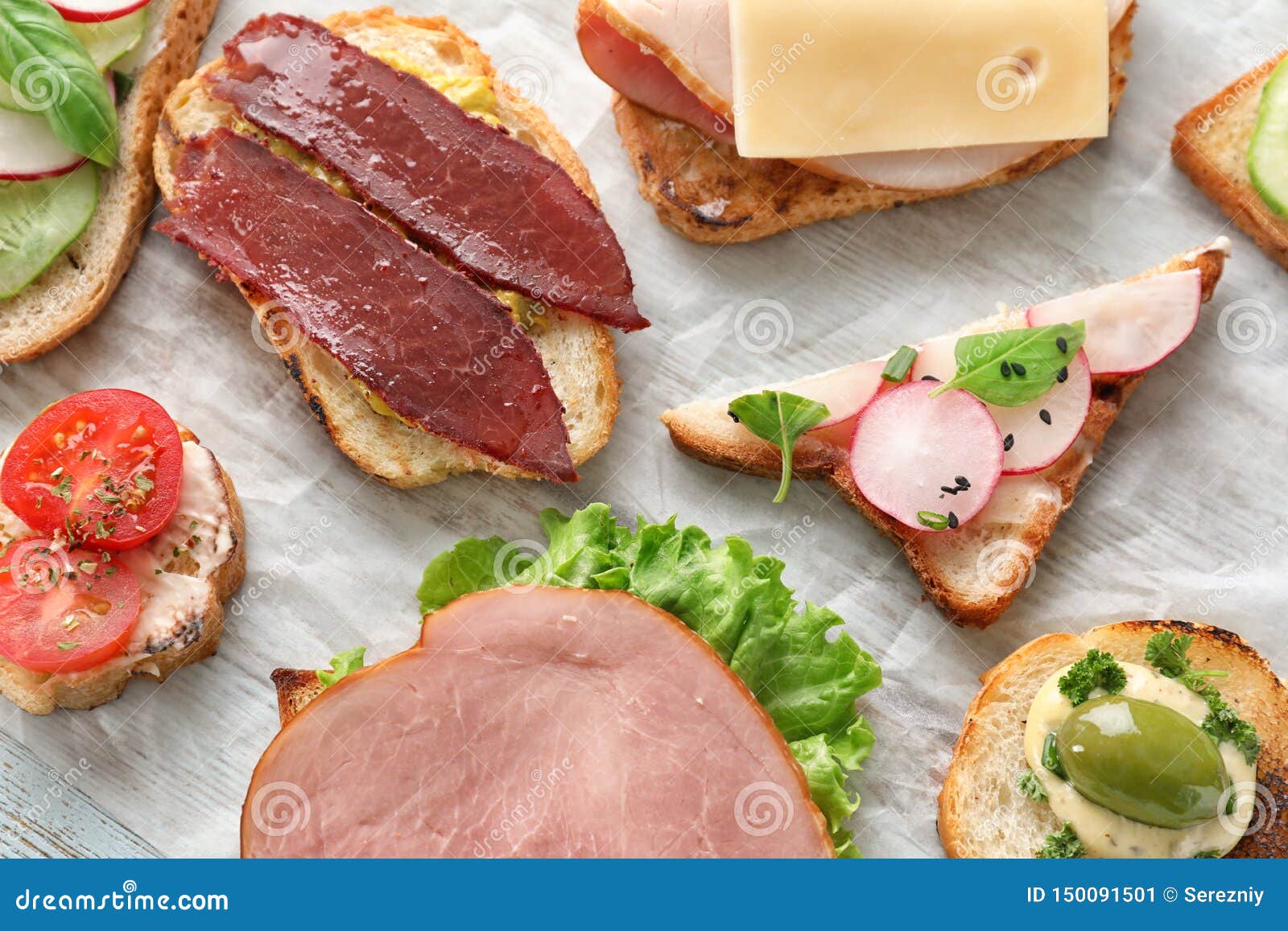 Different Delicious Toasts on Table Stock Image - Image of slice ...