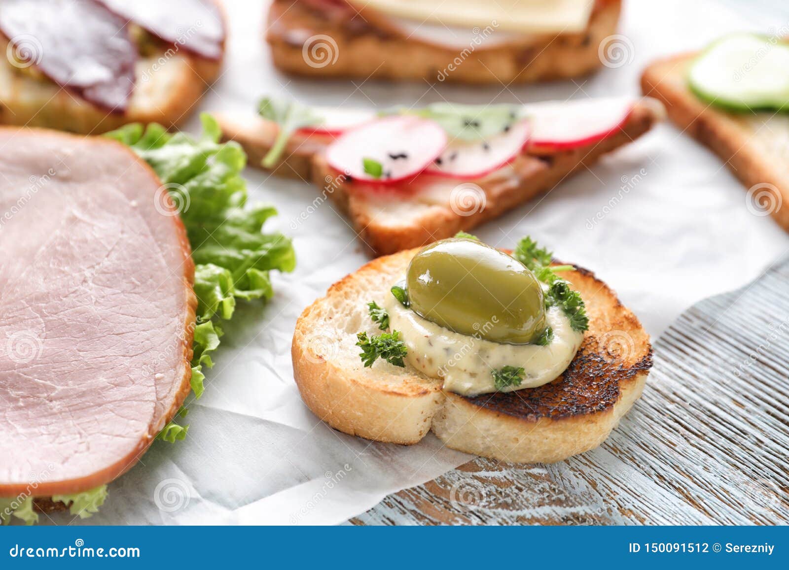 Different Delicious Toasts on Table Stock Photo - Image of lettuce ...