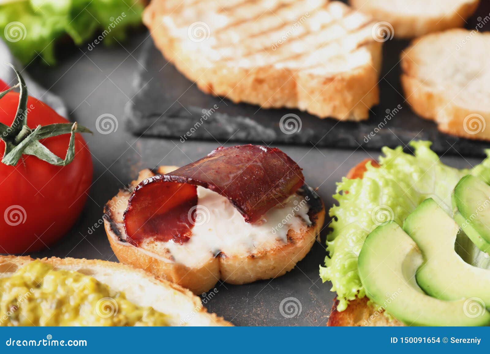 Different Delicious Toasts on Table Stock Photo - Image of nutrition ...