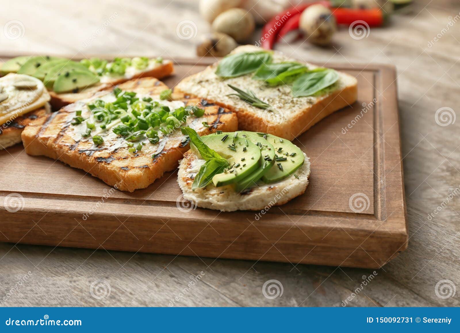 Different Delicious Toasts on Wooden Board Stock Image - Image of ...