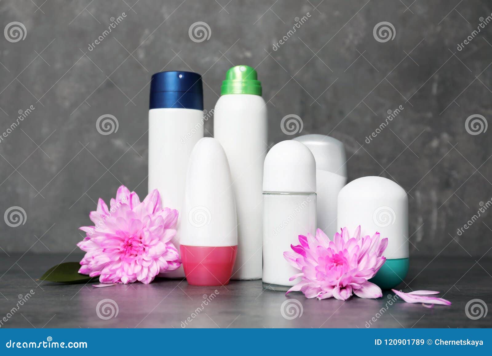 Different Deodorants and Flowers on Table Stock Image - Image of bloom ...