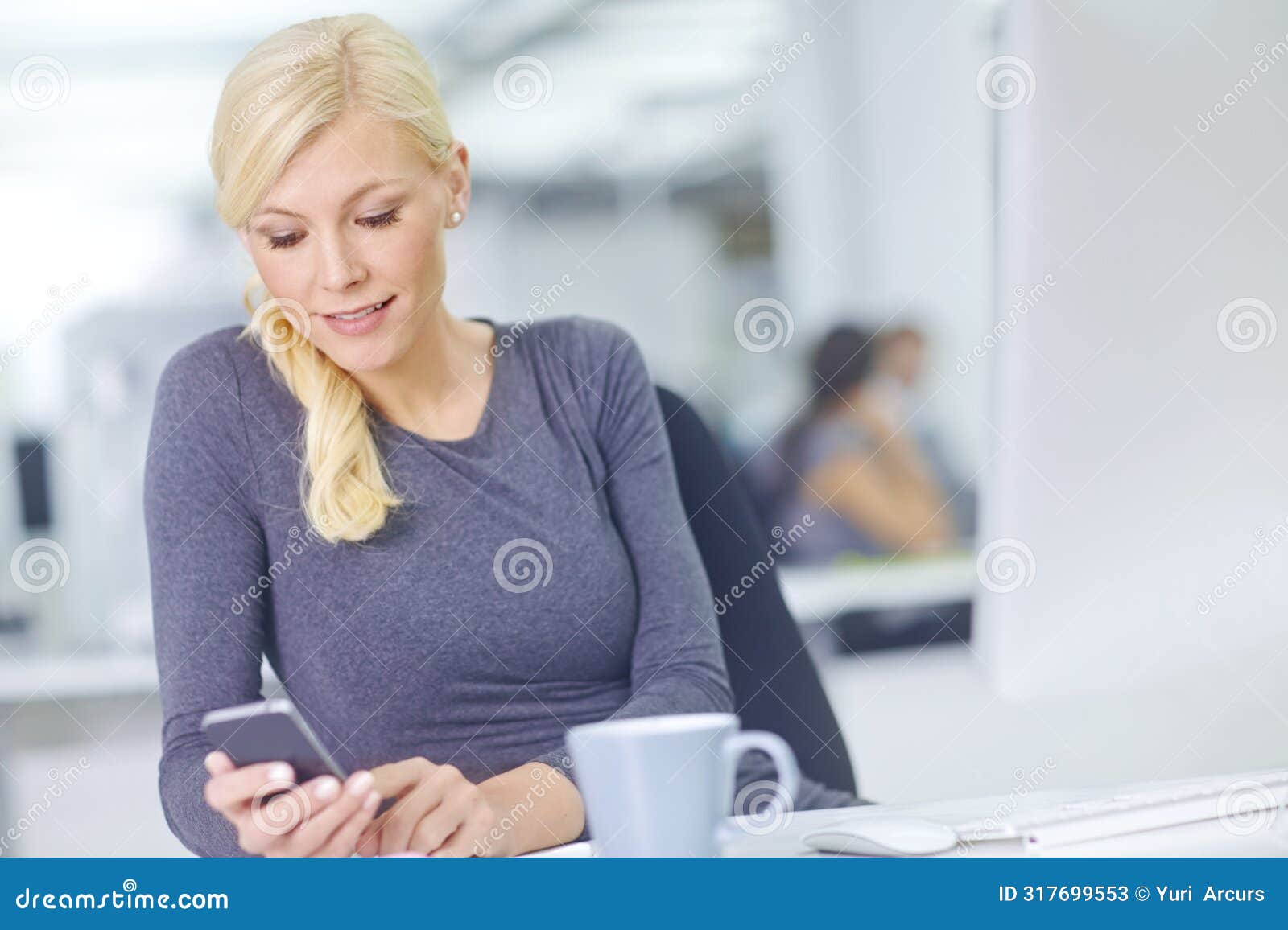Different Devices for Different Tasks. a Young Woman Using a Cellphone ...