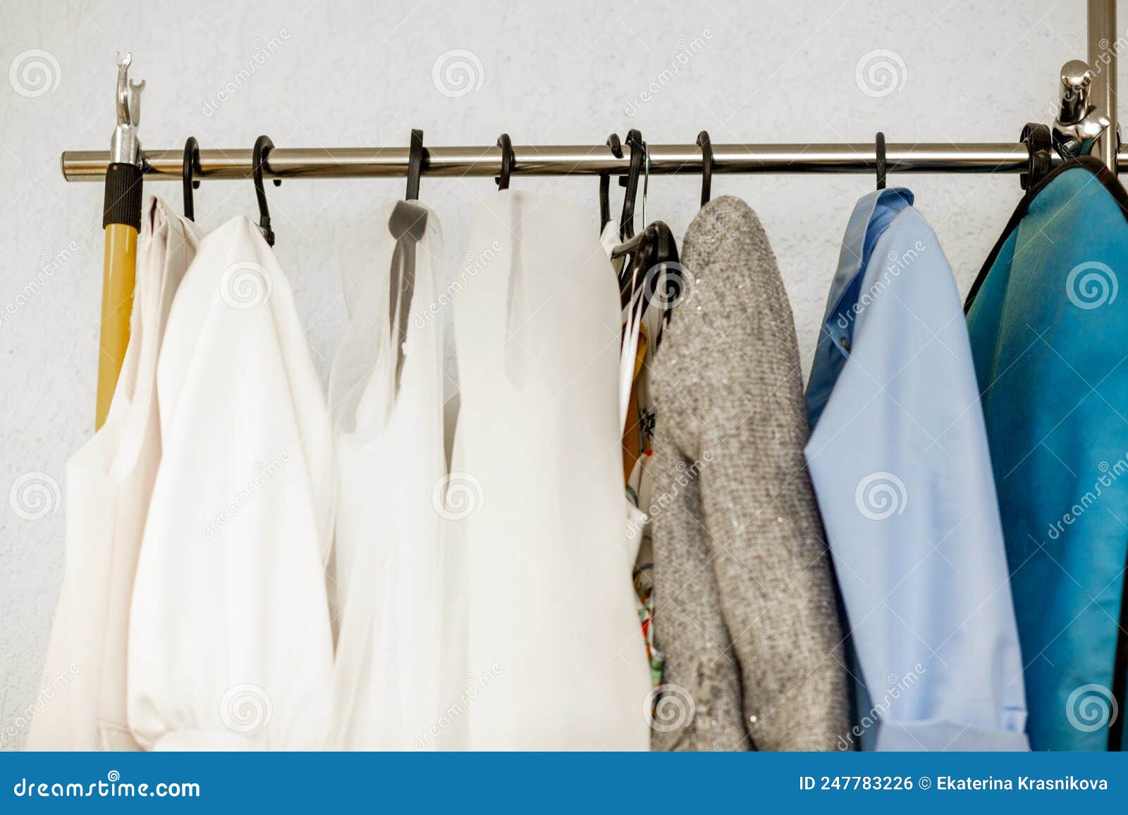 Different Dresses Hang on a Rack in the Atelier Stock Photo - Image of ...
