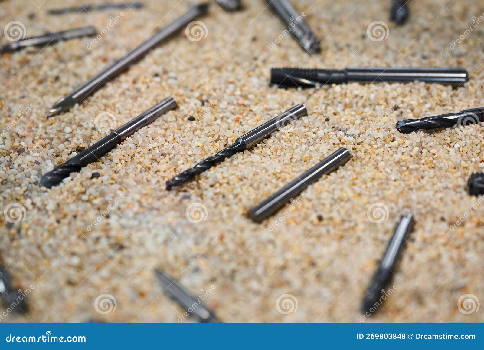 Different Drilling Tools on Sand Surface in Workshop Stock Photo ...