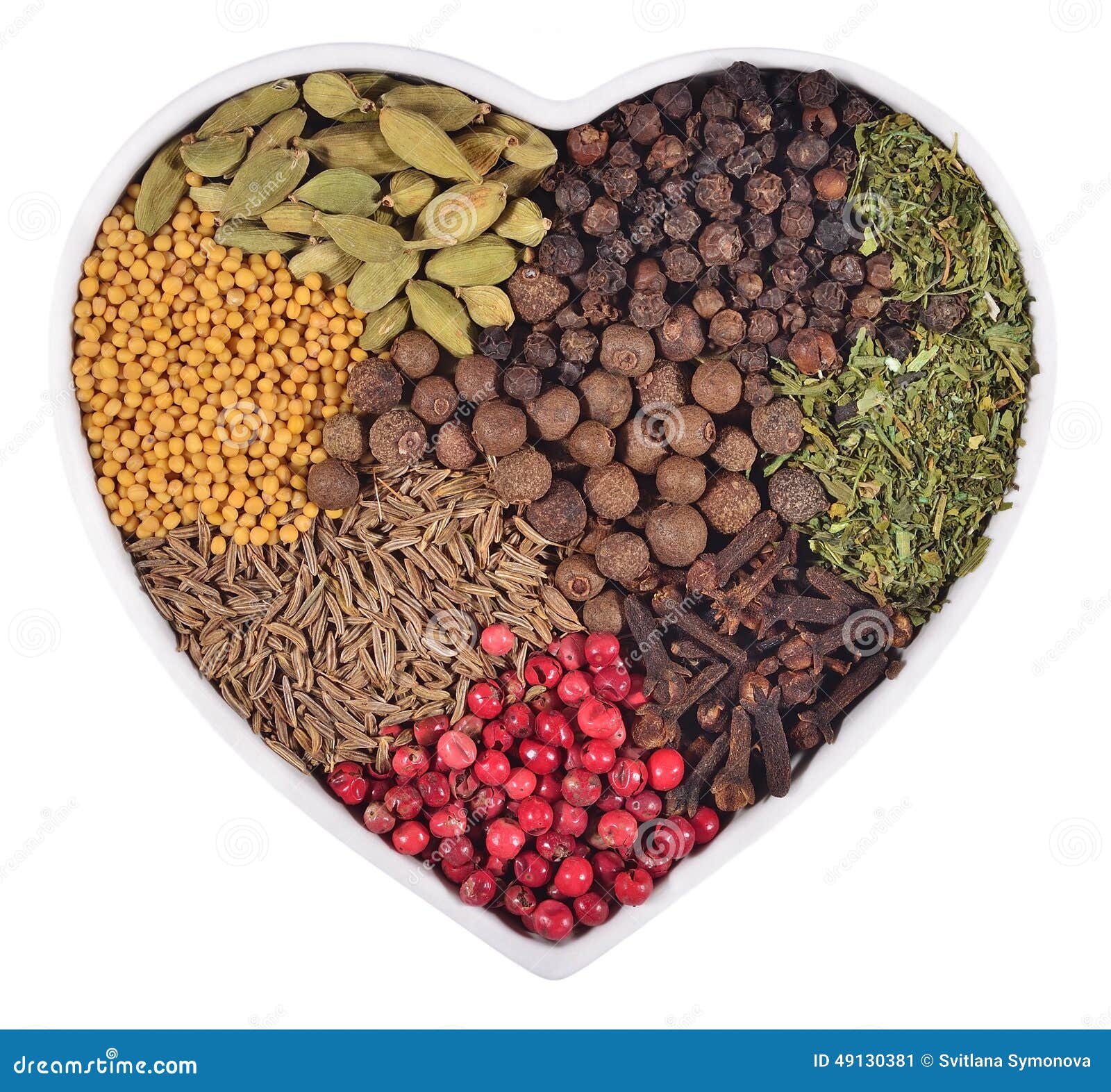 Different Dry Spices in Plate in the Form of Heart on a White Stock ...