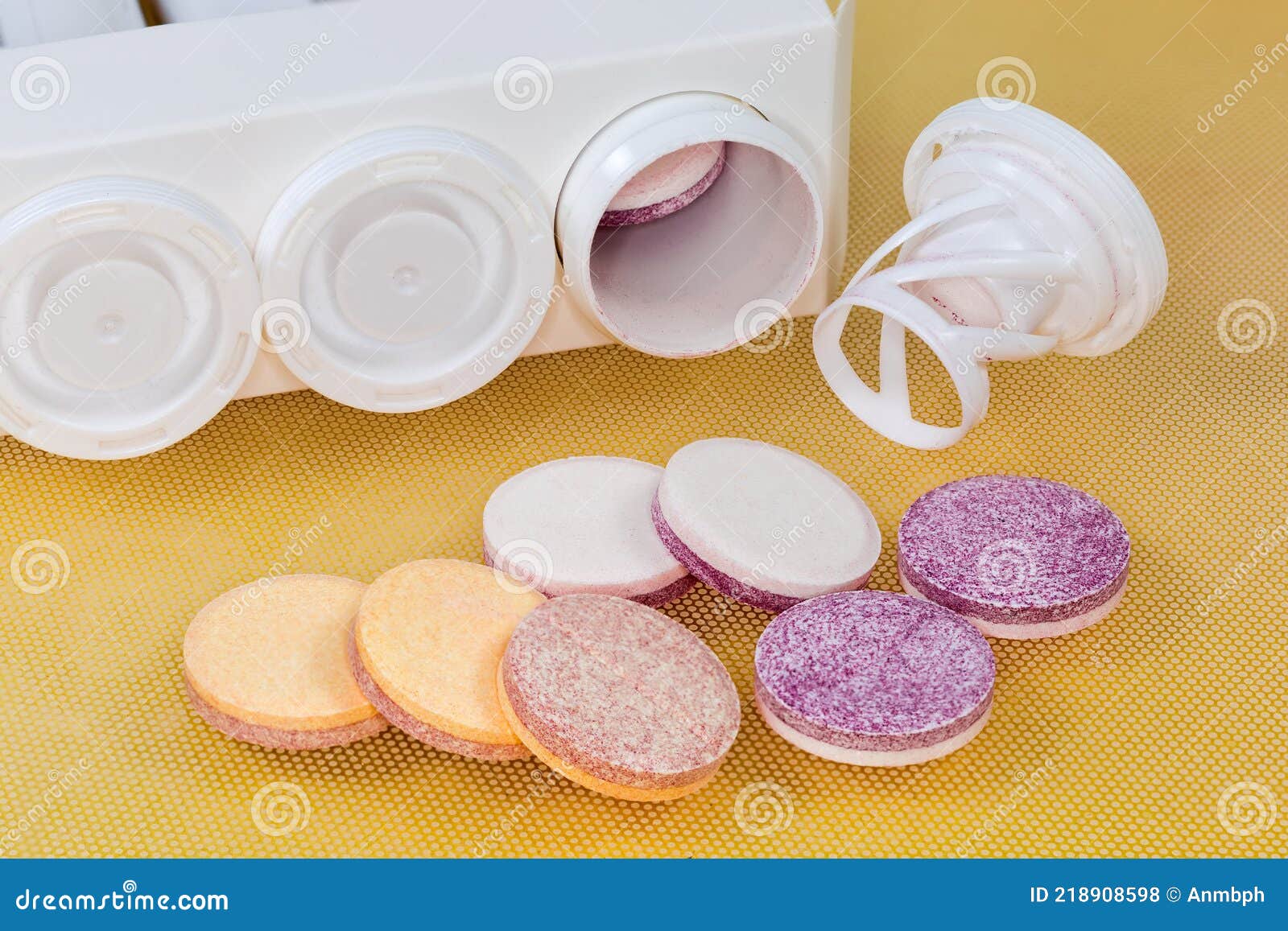 Different Effervescent Tablets Against the Their Packagings on Yellow ...
