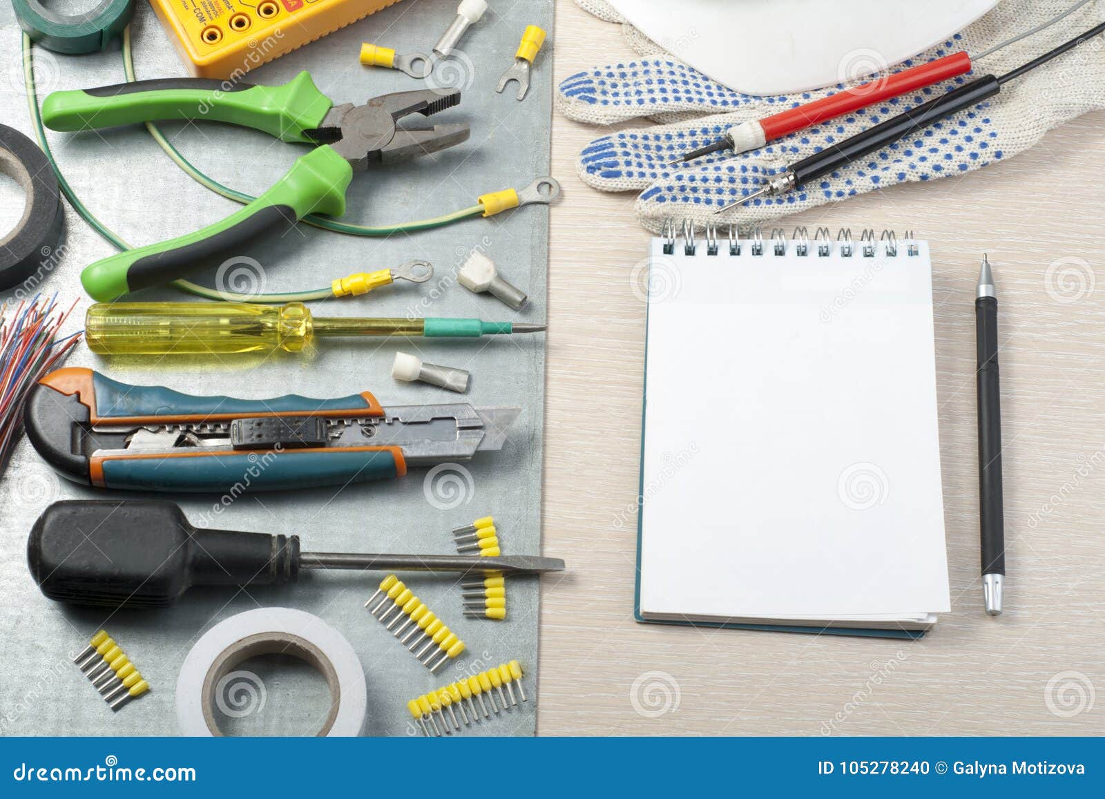 .Set of Electrical Tools, White Helmet and Notepad on Metallic ...