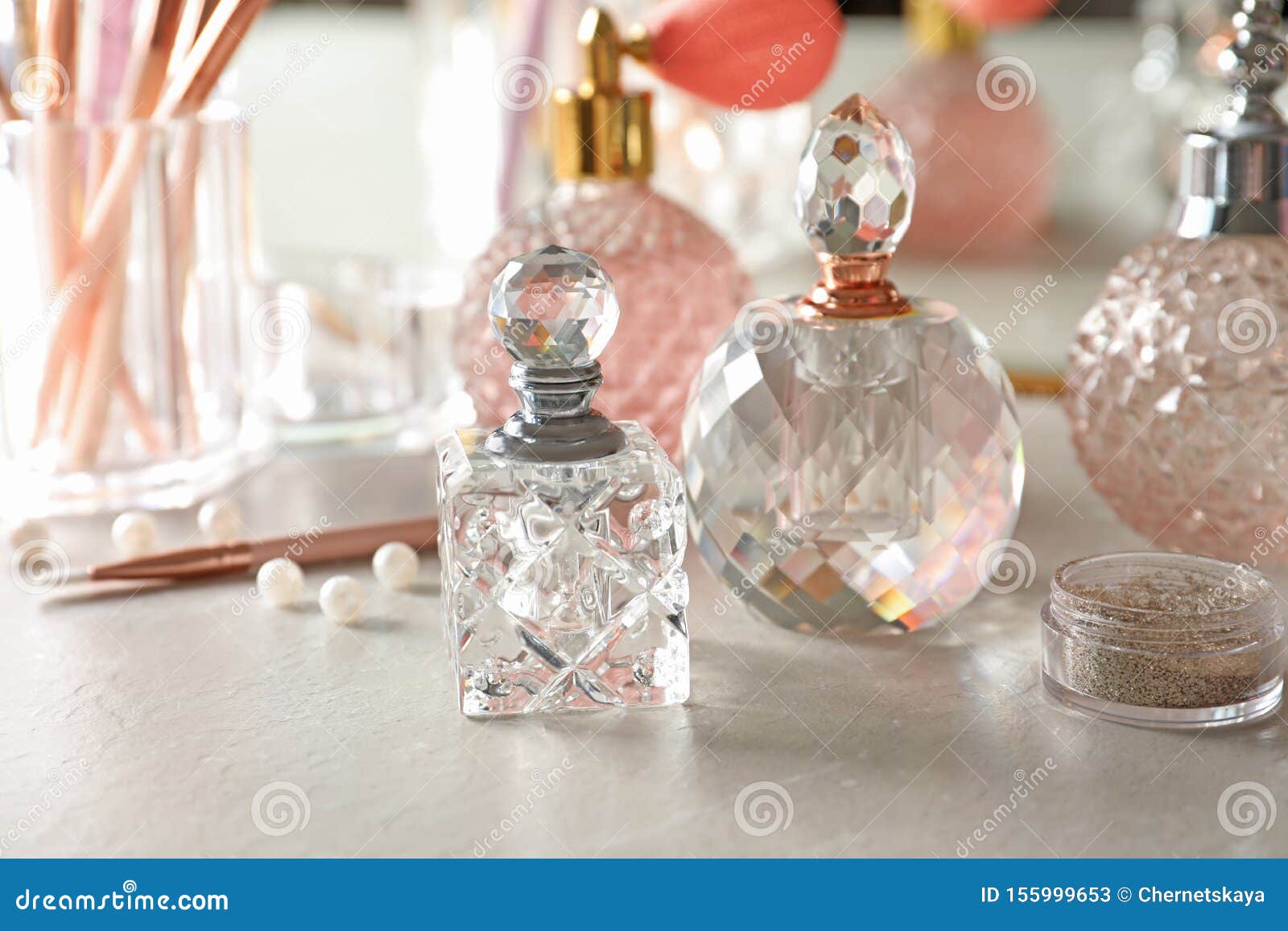 Different Elegant Perfume Bottles on Table Stock Image - Image of ...