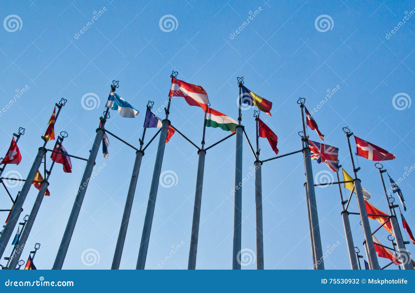 Different Flags on Background of Blue Sky Stock Photo - Image of ...